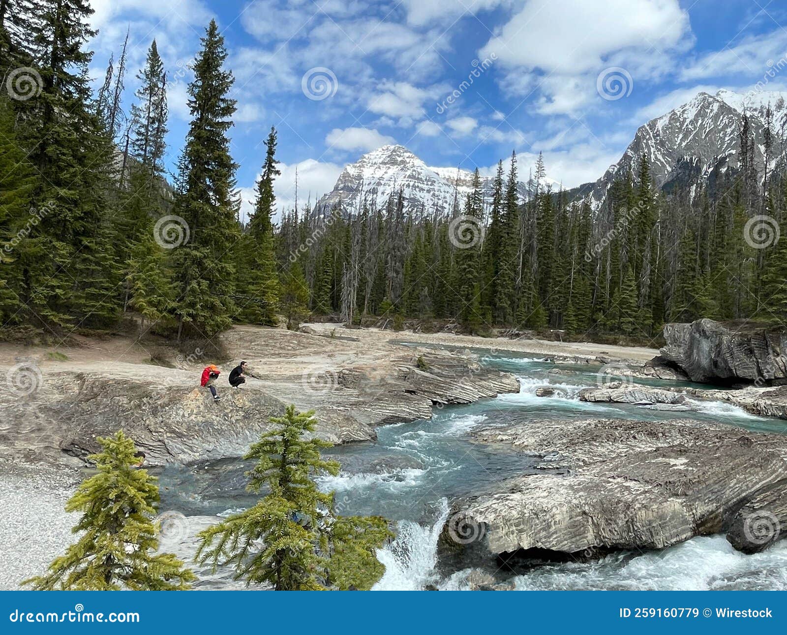 Two Boys Playing on the Rocks Near the River Stock Image - Image of ...
