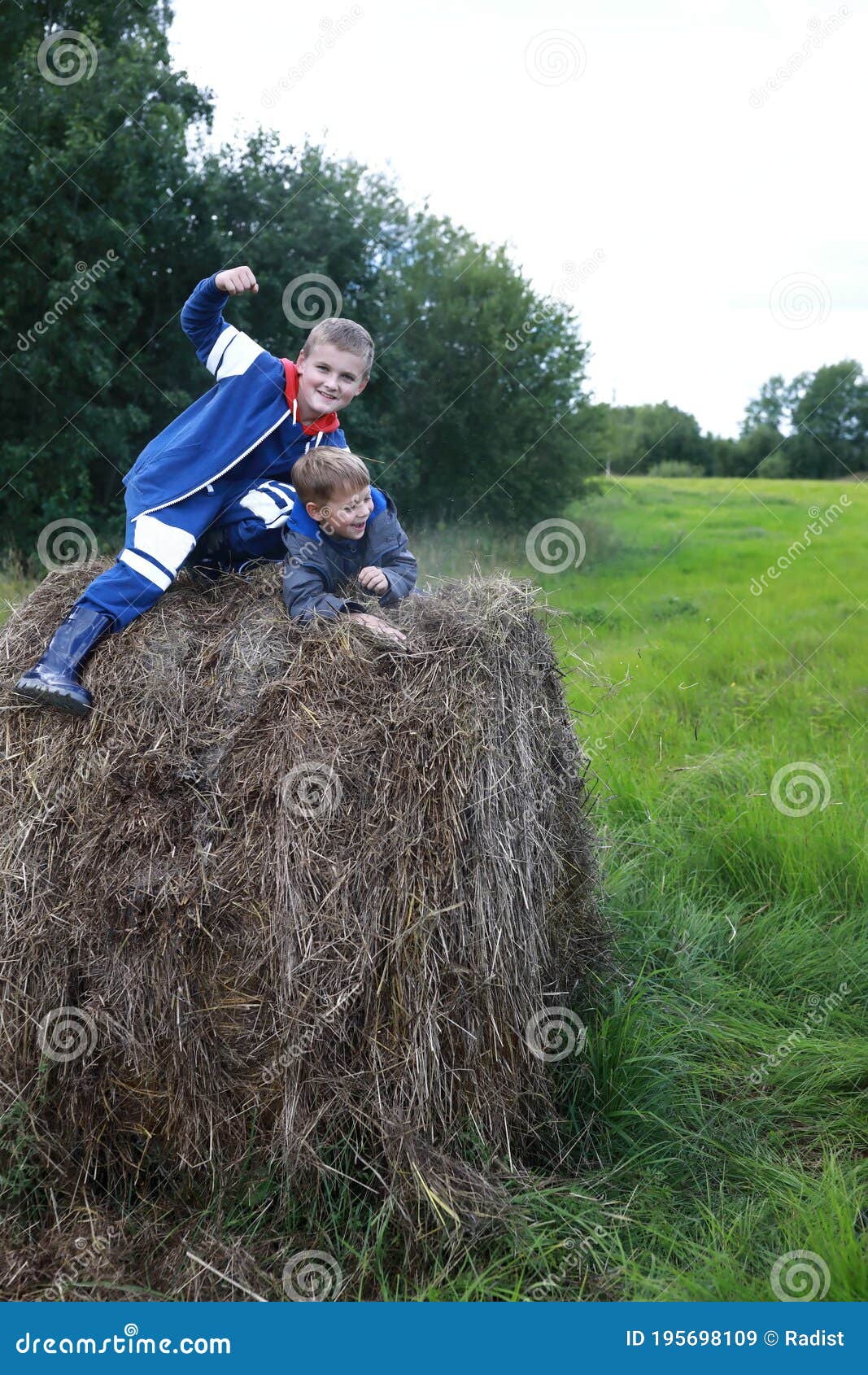 Two Boys Playing On Stack Of Straw Royalty-Free Stock Photo ...