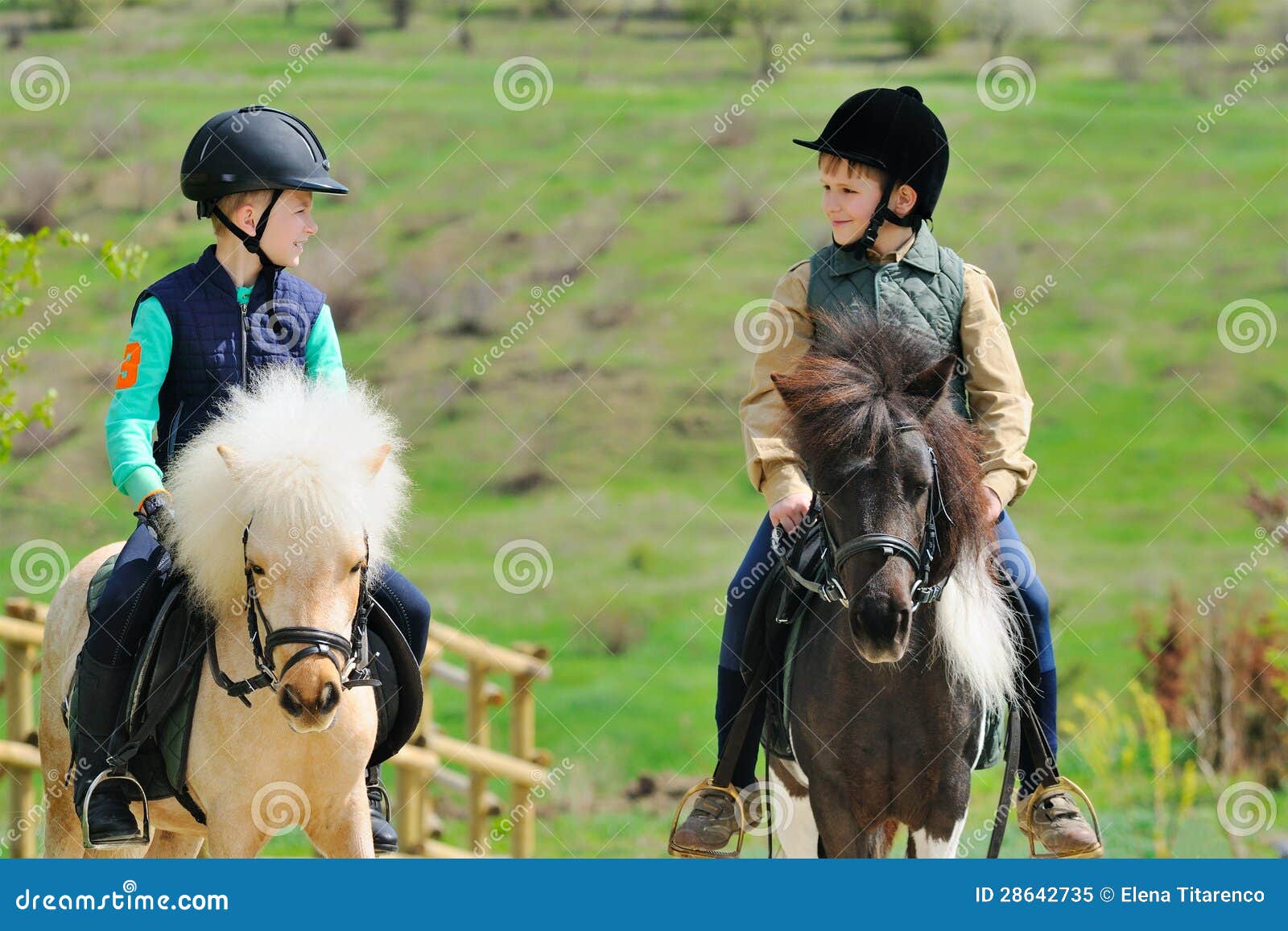 Two boys with ponies stock image. Image of female, leisure - 28642735