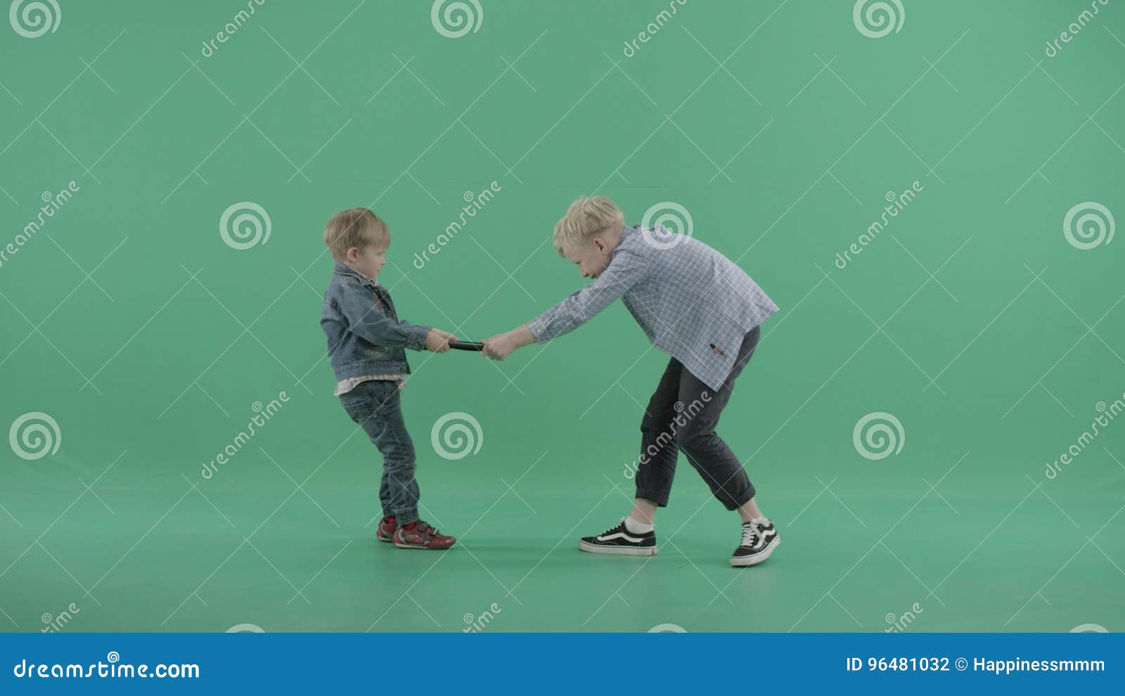 Two Boys Pulling a Tablet Pc in Opposite Directions Stock Footage ...