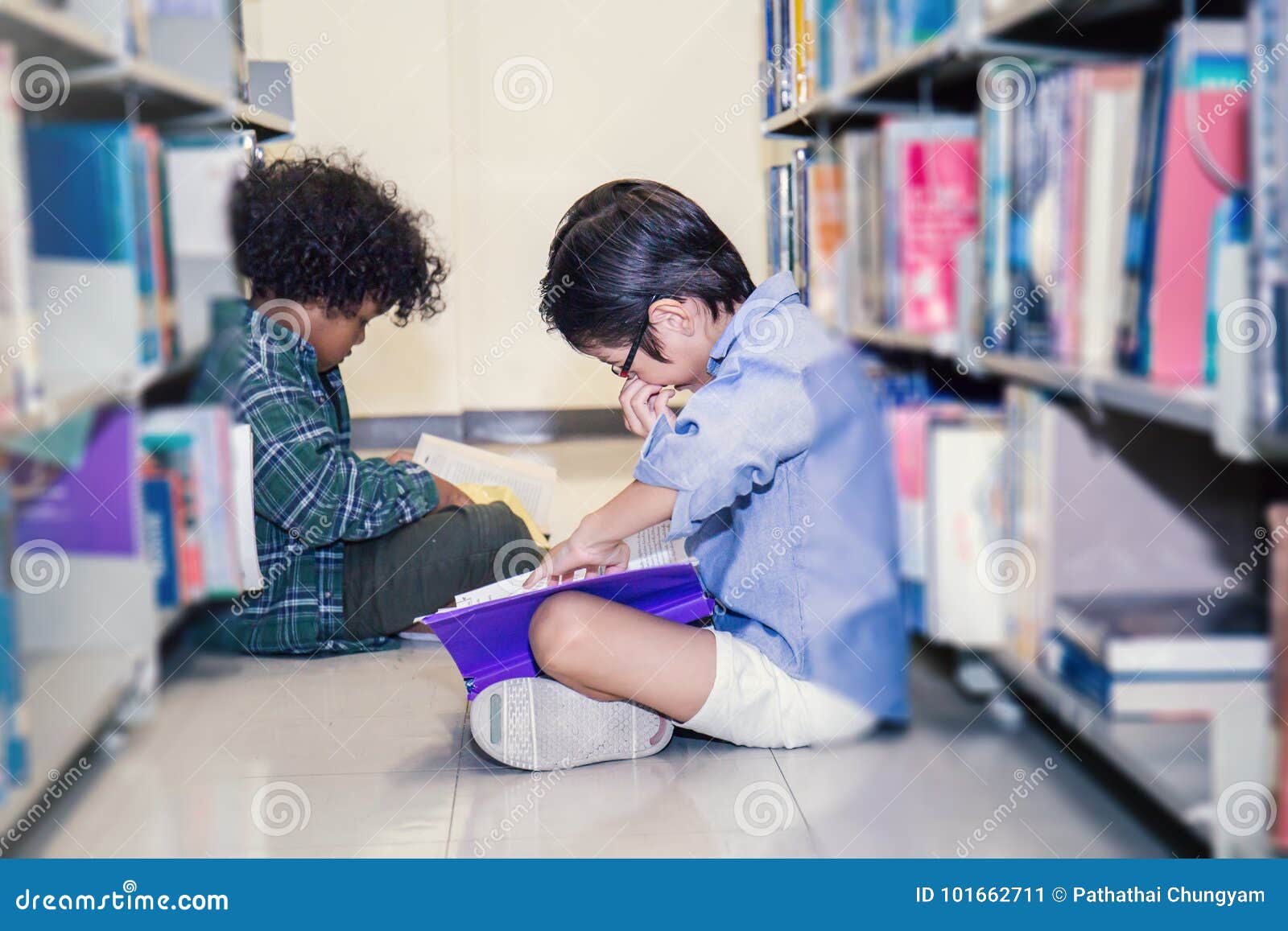 Two Boys Reading on the Library Floor Stock Image - Image of children ...