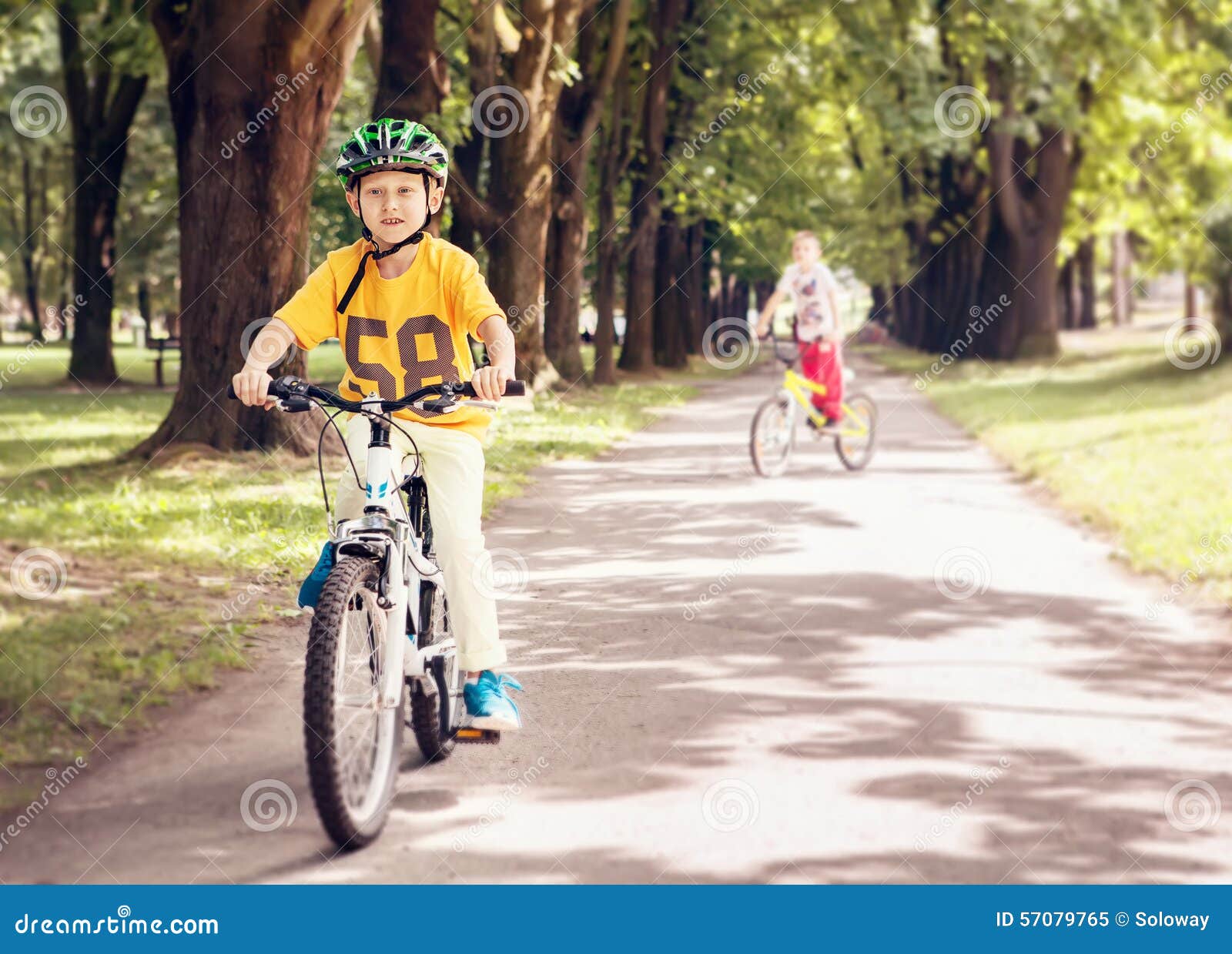 Two Boys Ride a Bicycle in Park Stock Image - Image of people, little ...