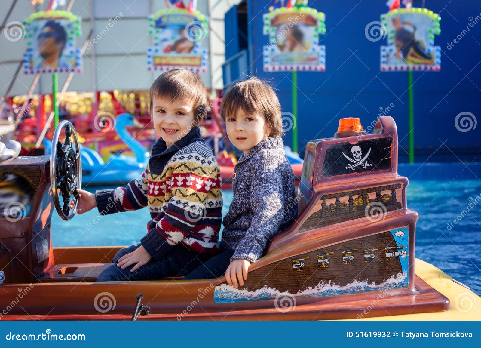 Two Boys, Riding Boat in Amusement Park Stock Photo - Image of colored ...