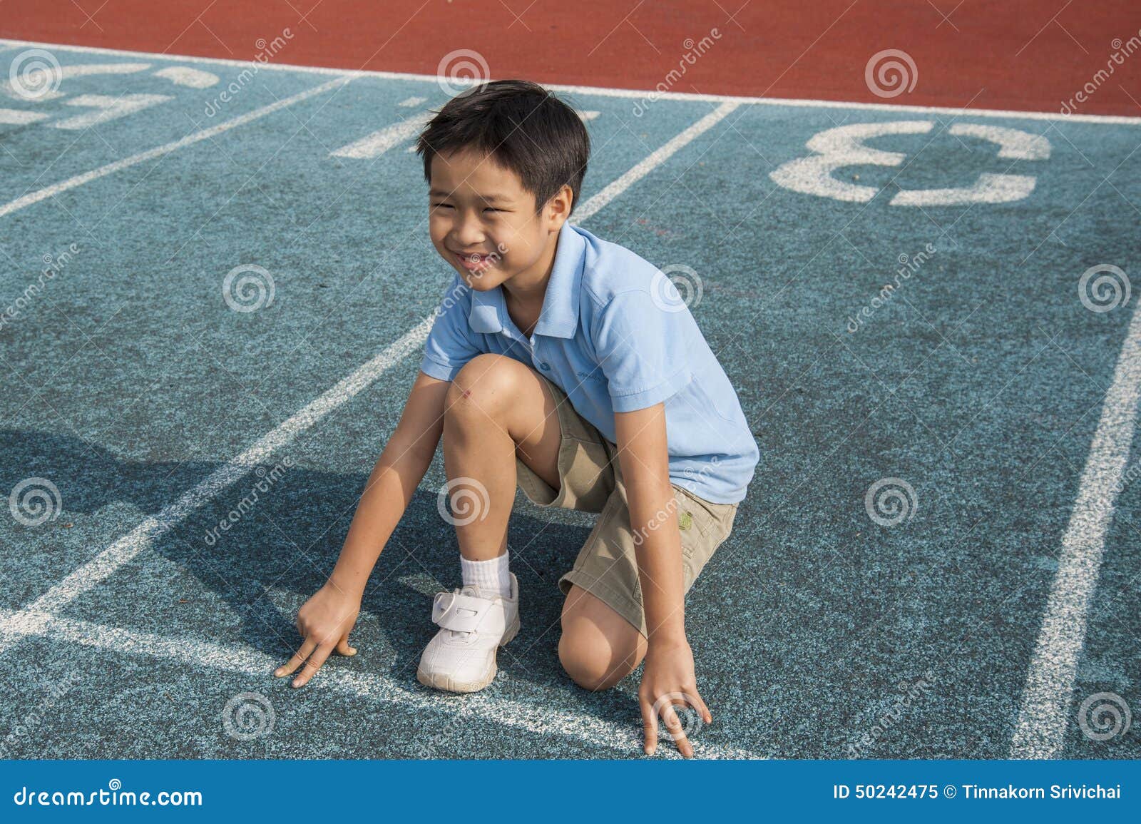 Two boys run on track stock image. Image of active, male - 50242475