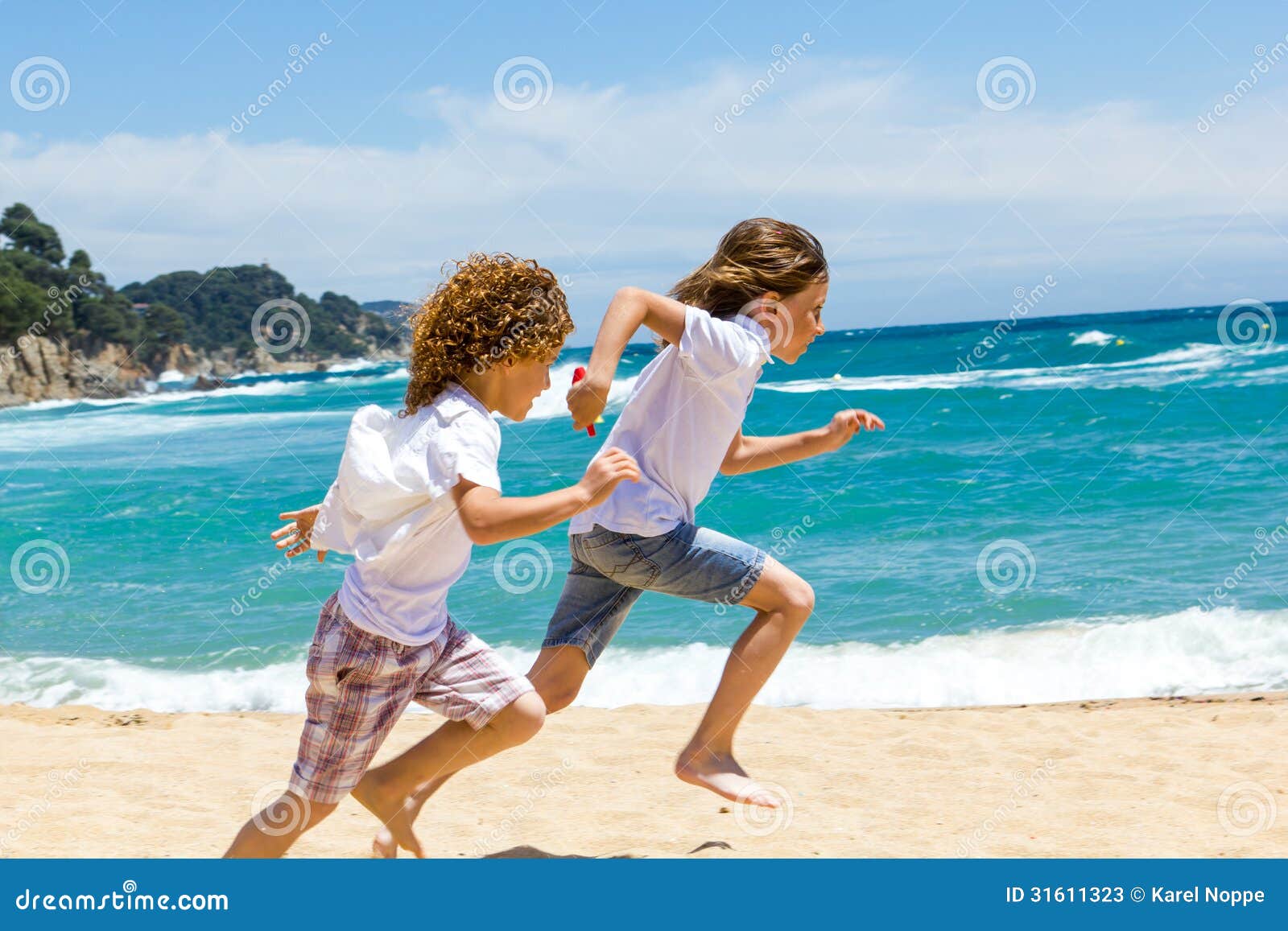 Two boys running on beach. stock image. Image of cute - 31611323