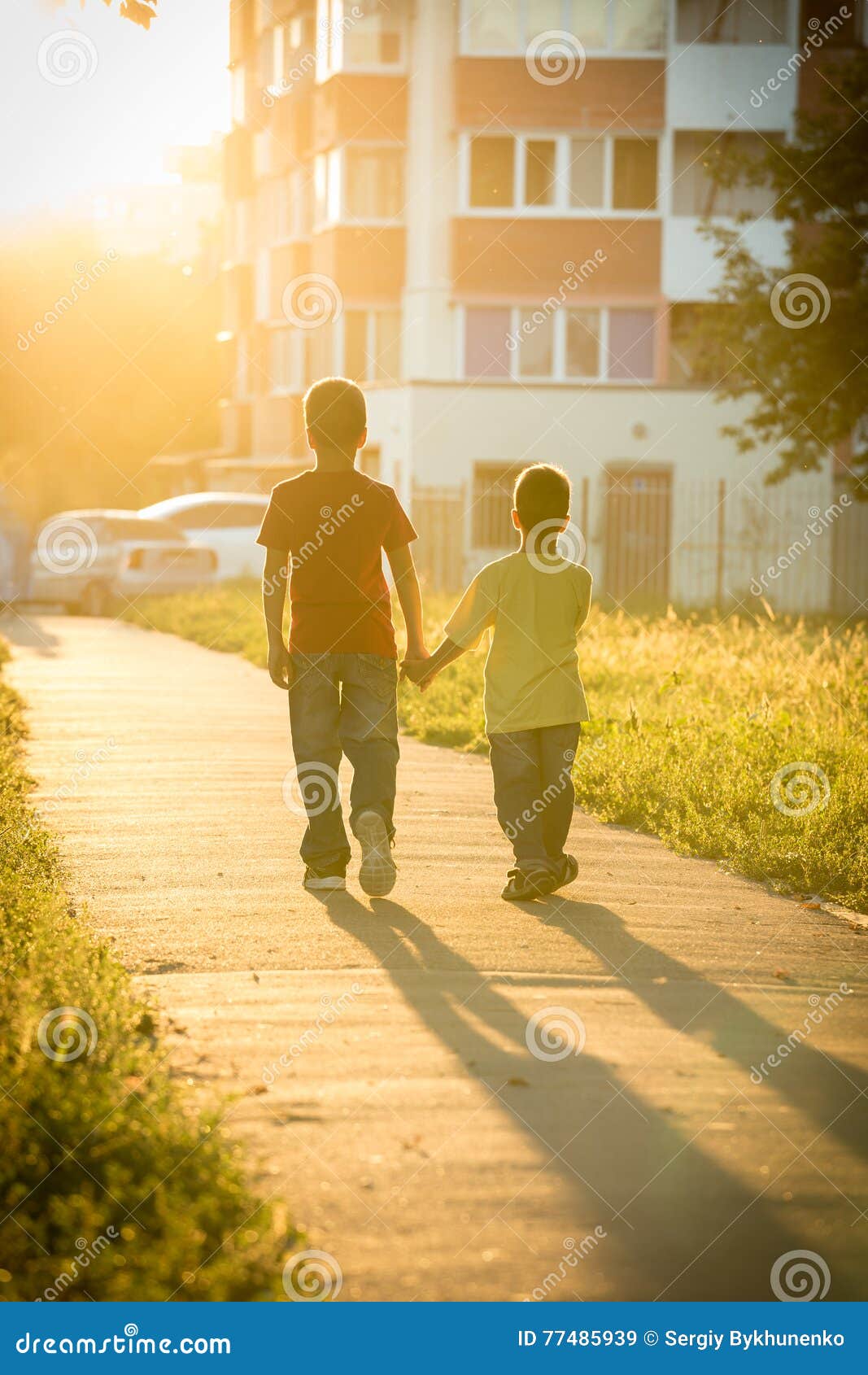 Two Boys Running Together on Street Stock Image - Image of light ...