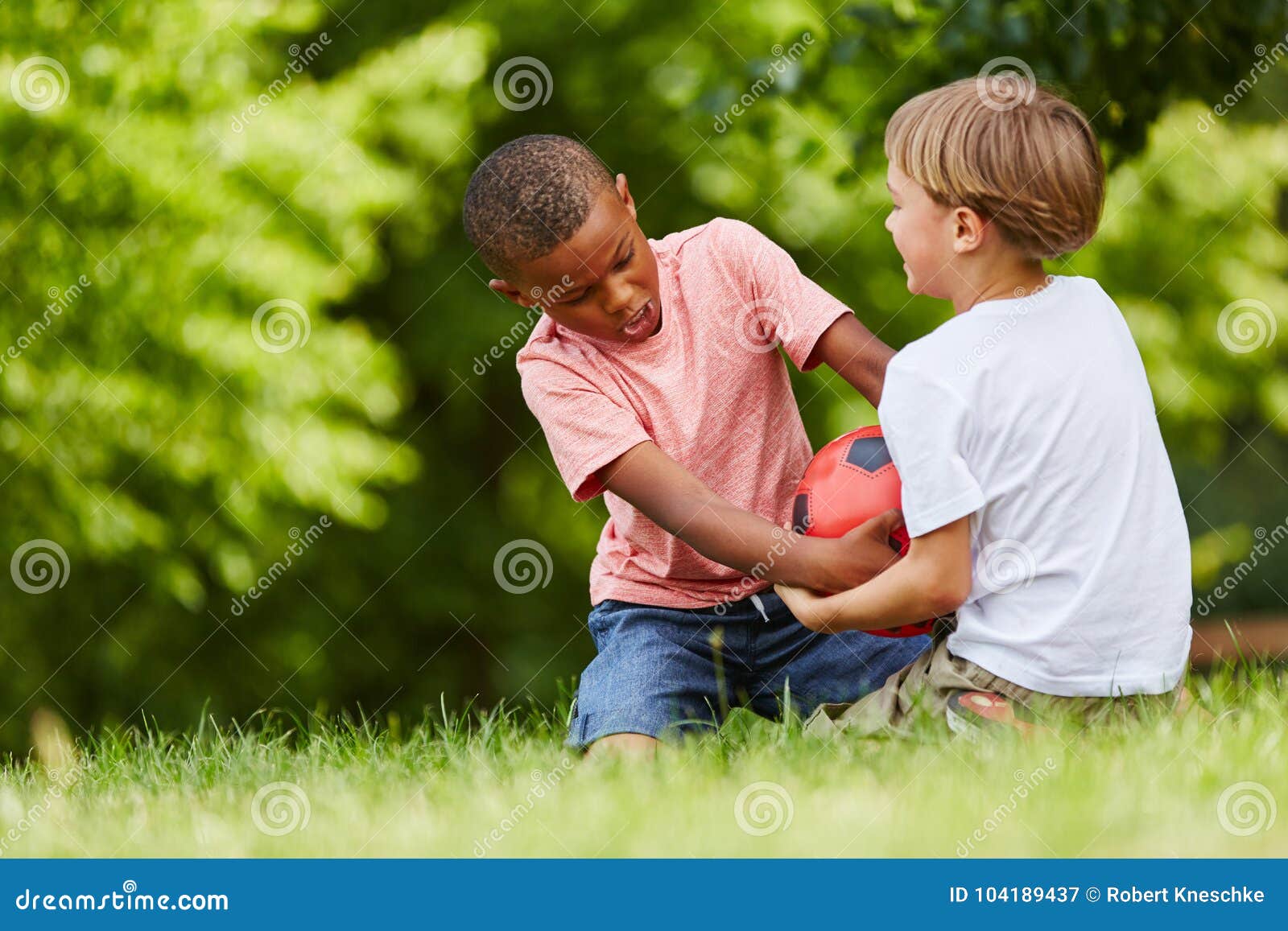 Two Boys Scuffle for Soccer Ball Stock Image - Image of friendship ...