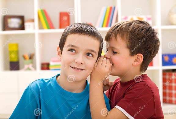 Two boys sharing a secret stock photo. Image of childhood - 17947186