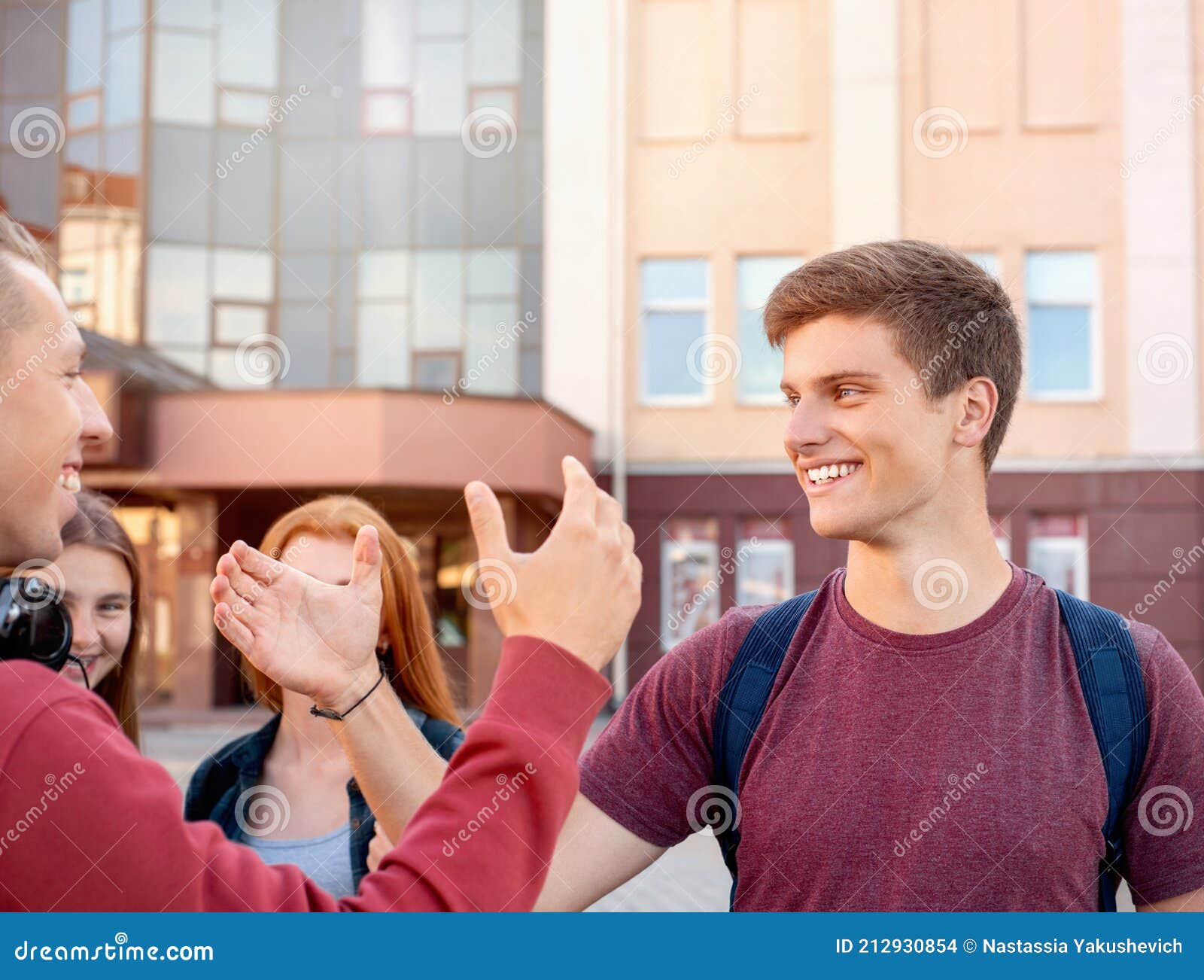 Two Boys Students Greeting Each Other Near Campus Stock Photo - Image ...