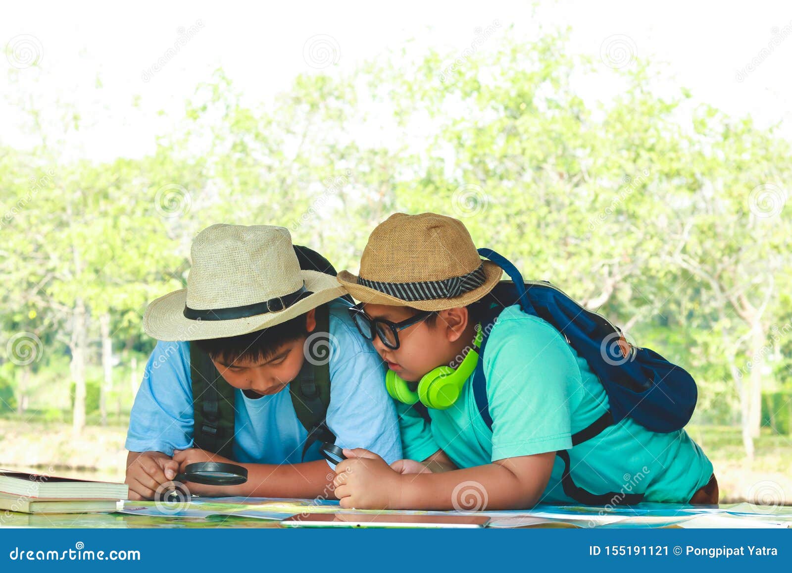 Two boys study paper map stock image. Image of magnifying - 155191121