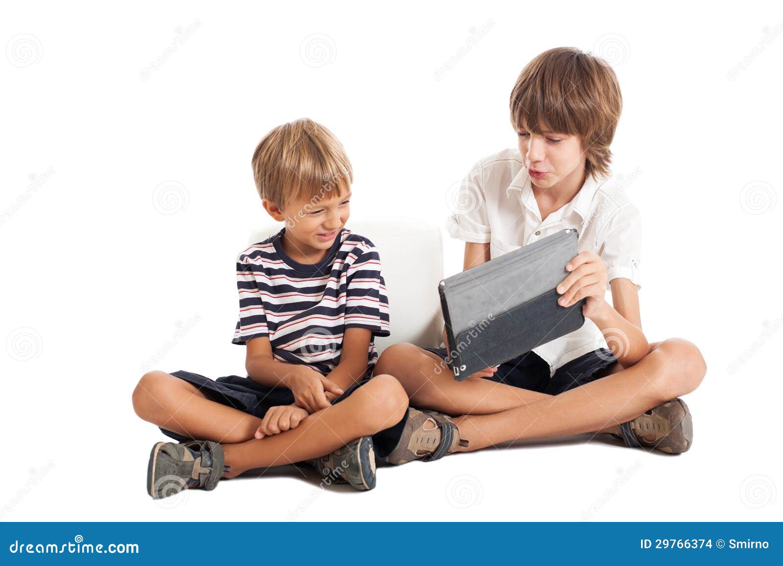 Two boys with a tablet PC stock photo. Image of playing - 29766374