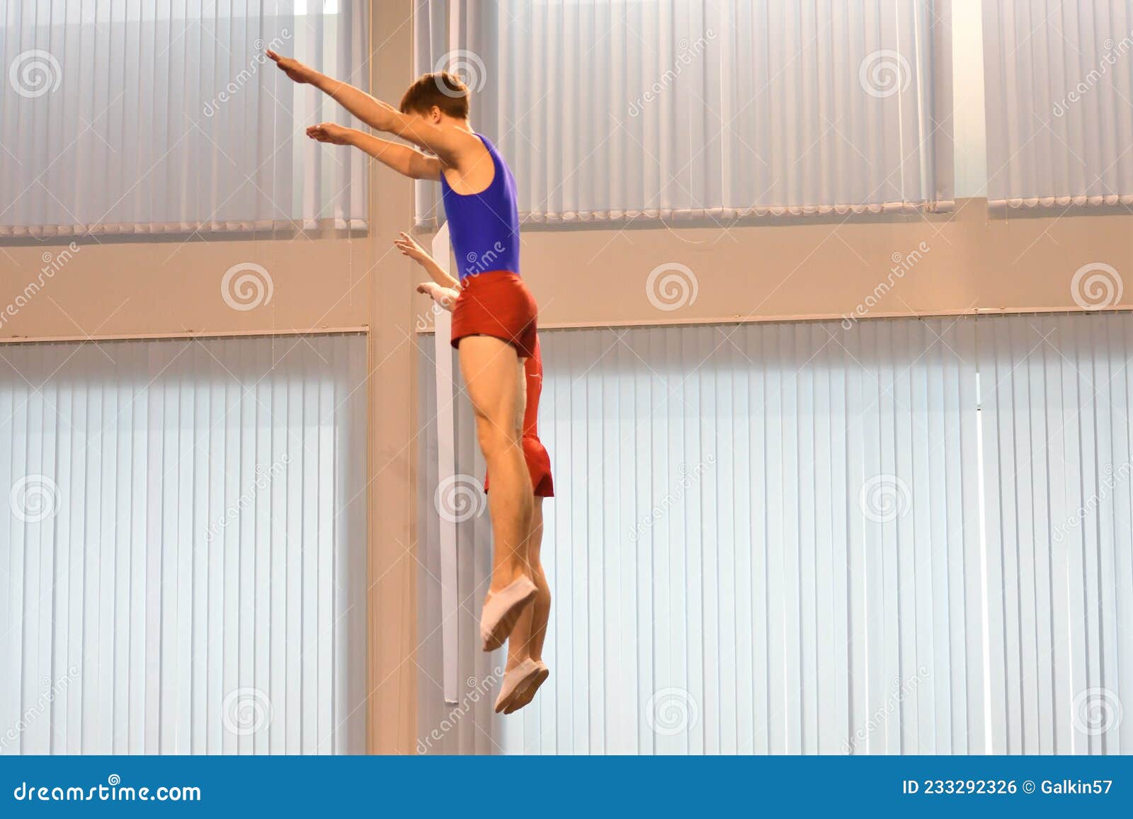 Boys Train in Synchronized Jumping on a Trampoline Stock Photo - Image ...