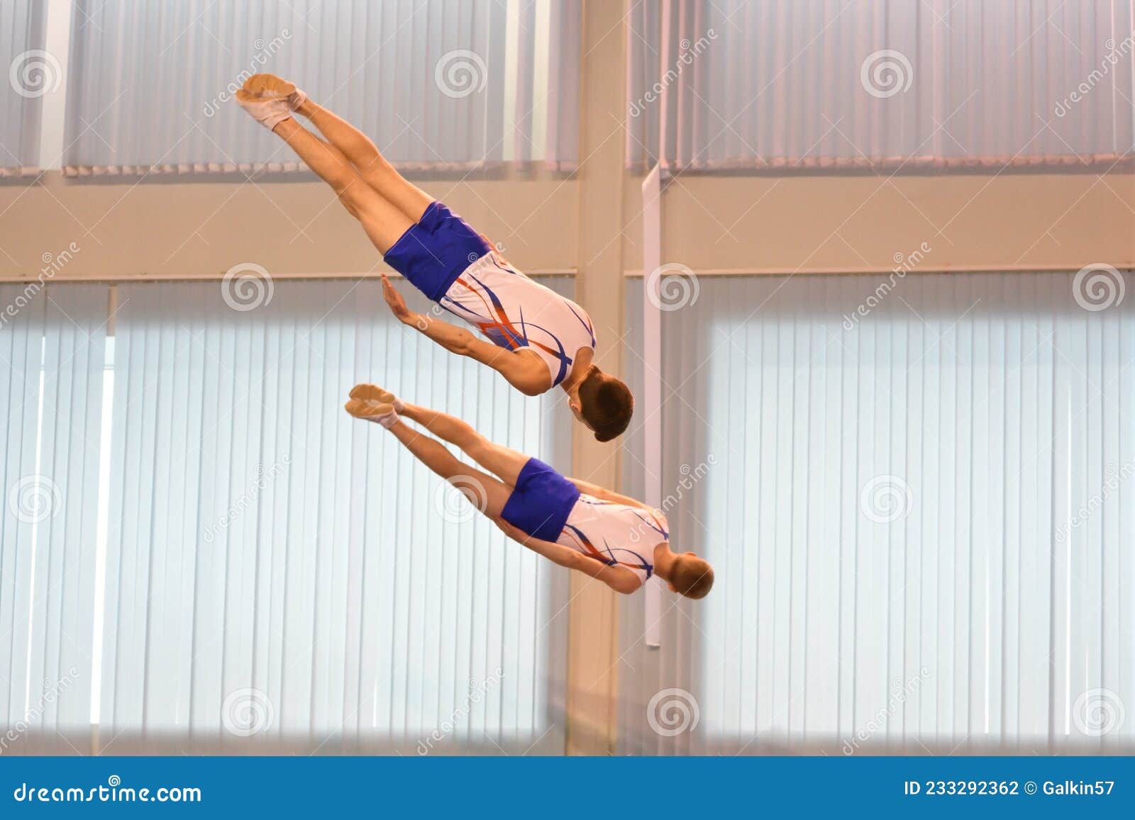 Boys Train in Synchronized Jumping on a Trampoline Stock Photo - Image ...