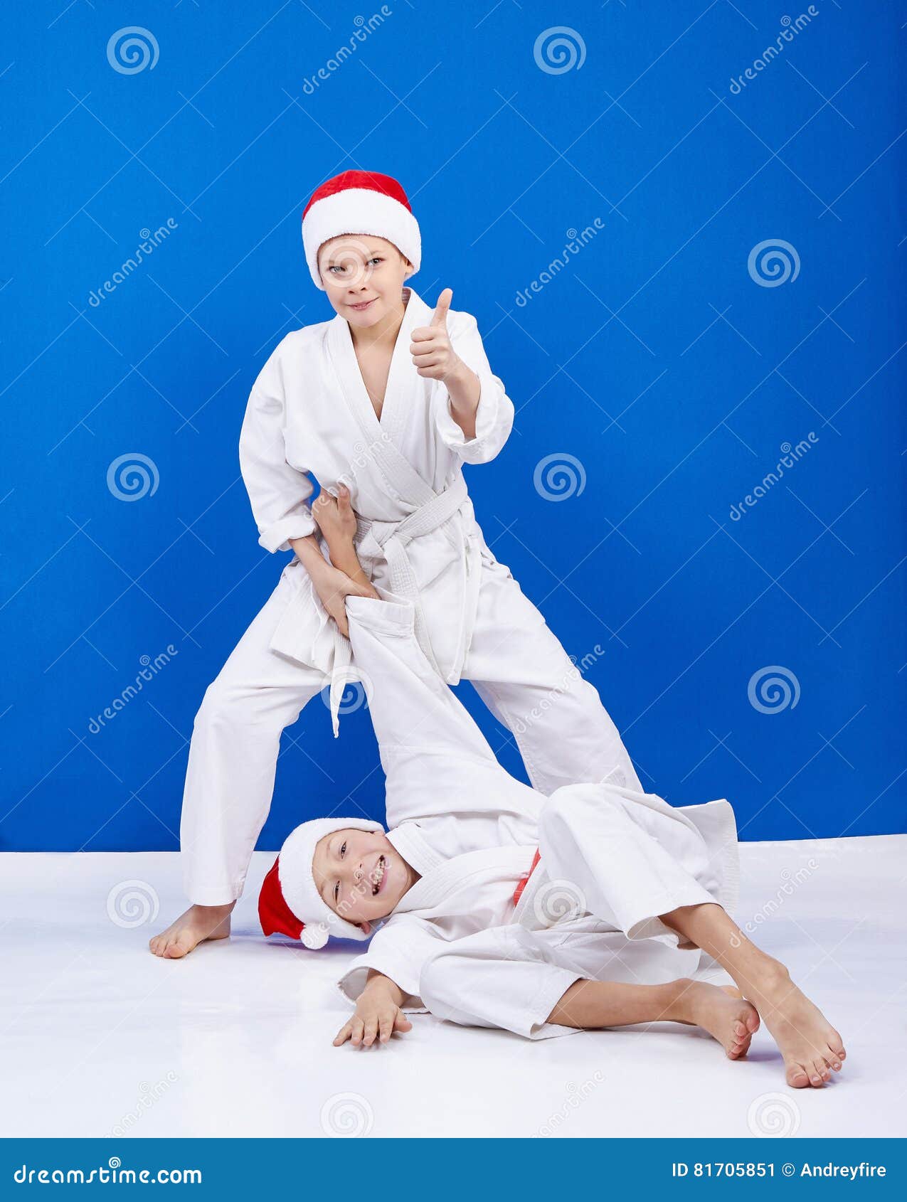 Two Boys are Trained Judo Throws in Santa Claus Caps Stock Image ...