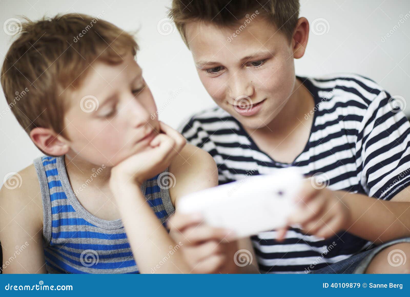 Two Boys Using a Cellphone, Smiling Stock Image - Image of playing ...