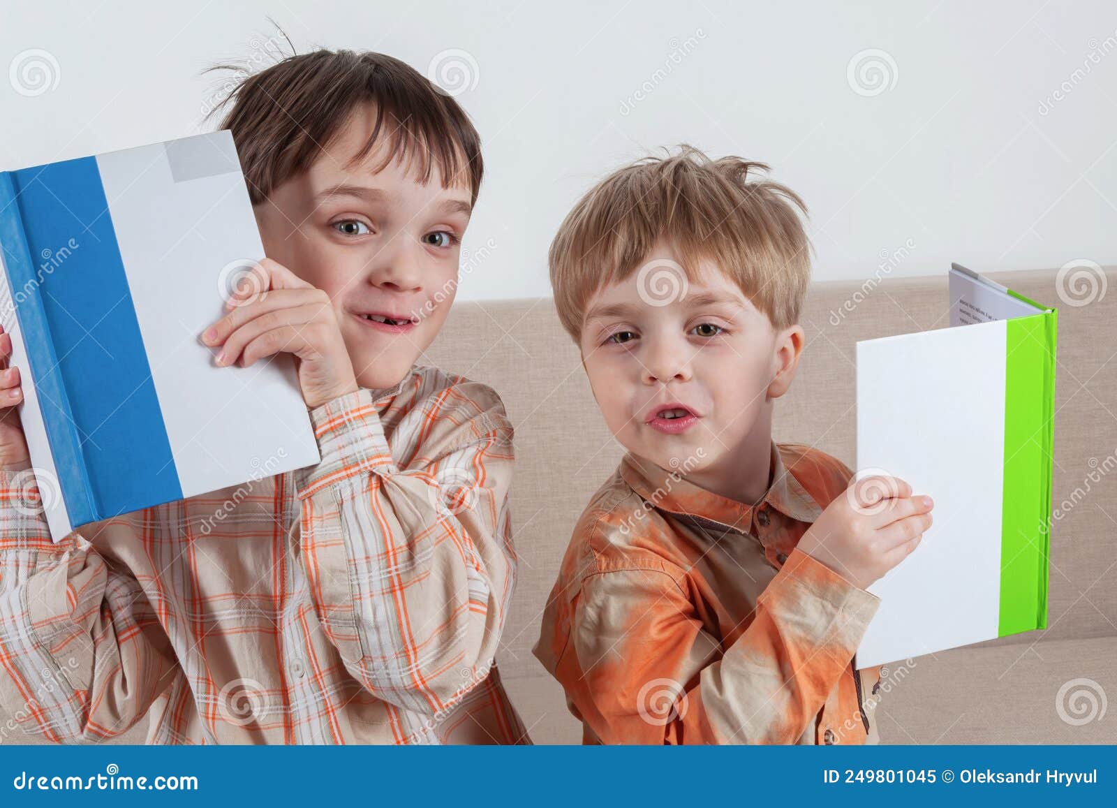 Two Boys Were Reading Books. they Looked Out of the Books at the Same ...