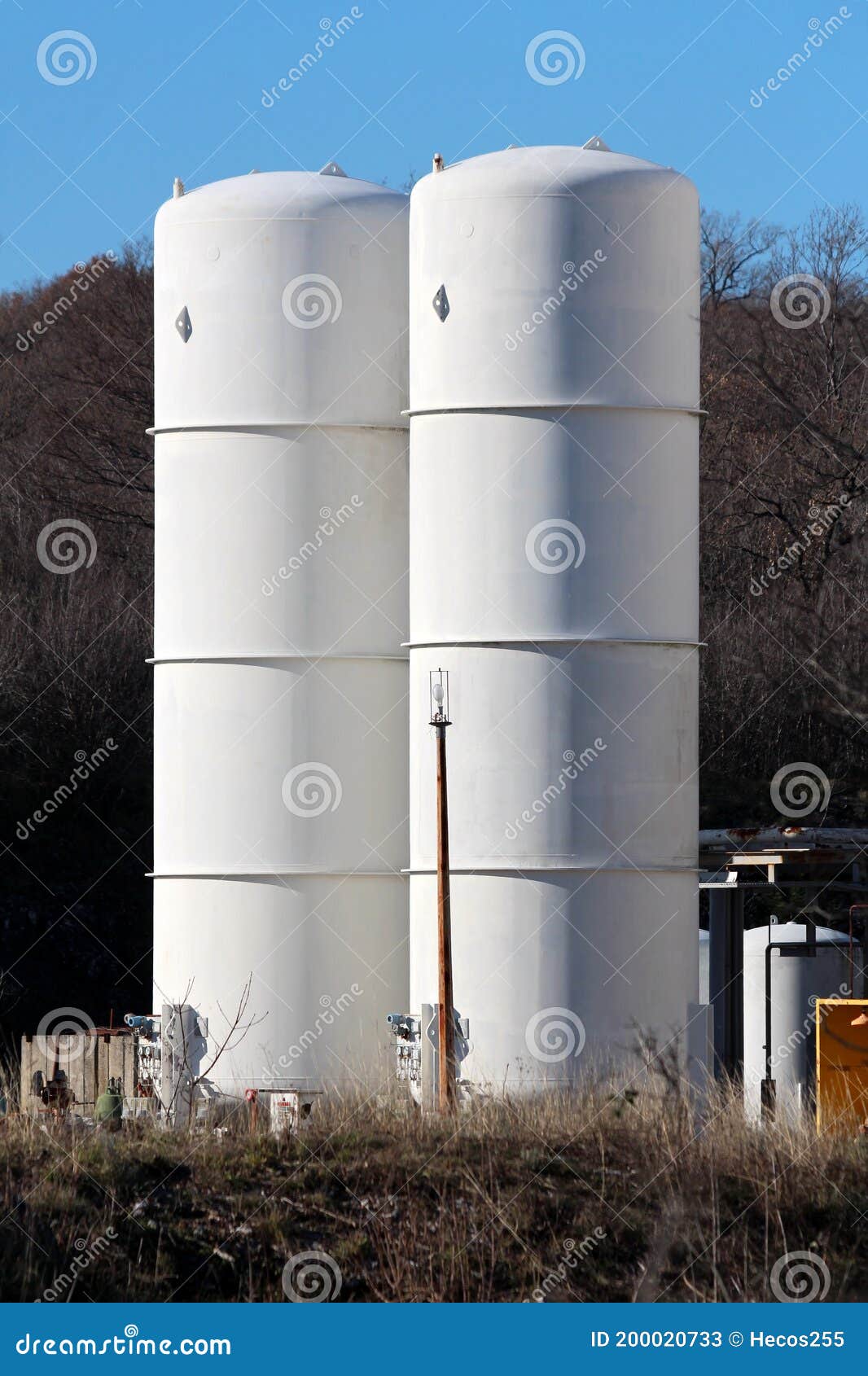 Two Brand New White Storage Silos Installed at the Edge of Modernized ...