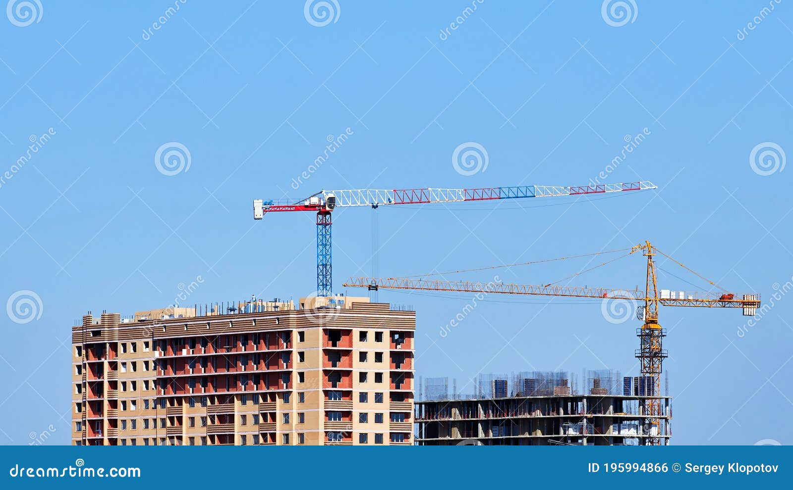 Two Brick Buildings are Being Built Using Two Tower Cranes Stock Photo ...