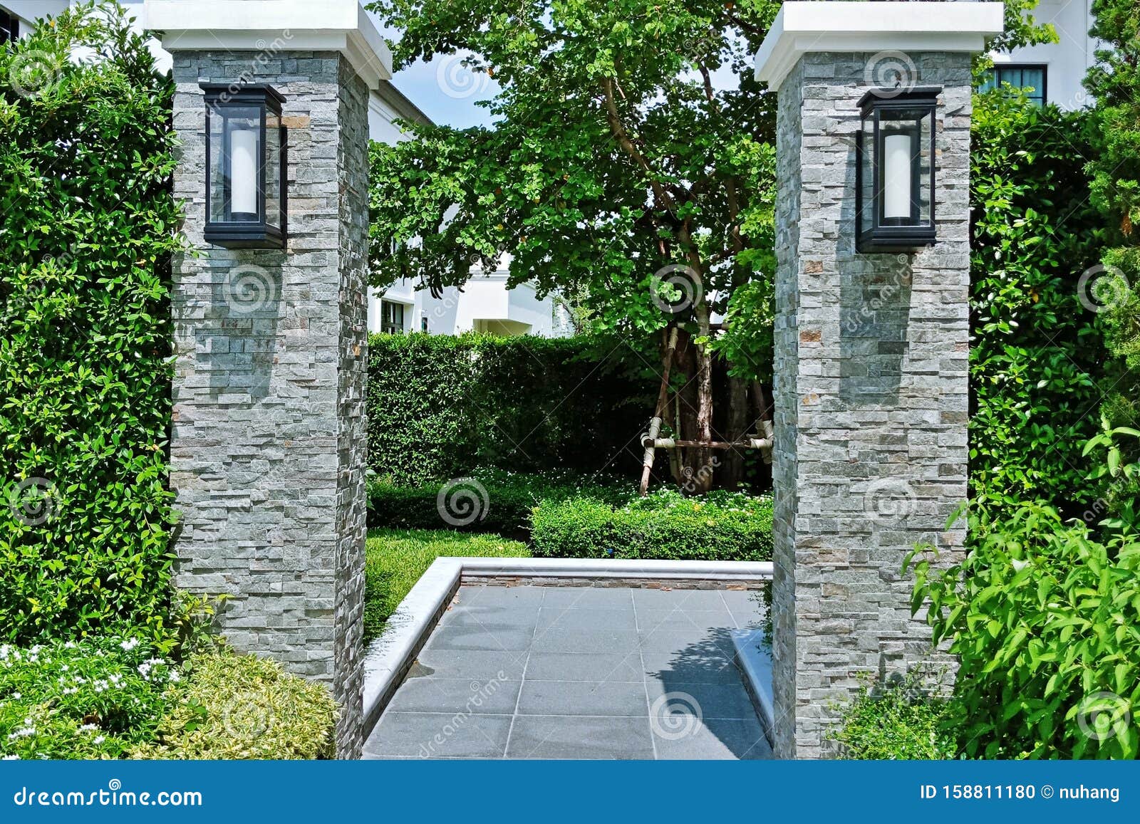 Two Brick Columns with Lights To the Garden Stock Photo - Image of ...