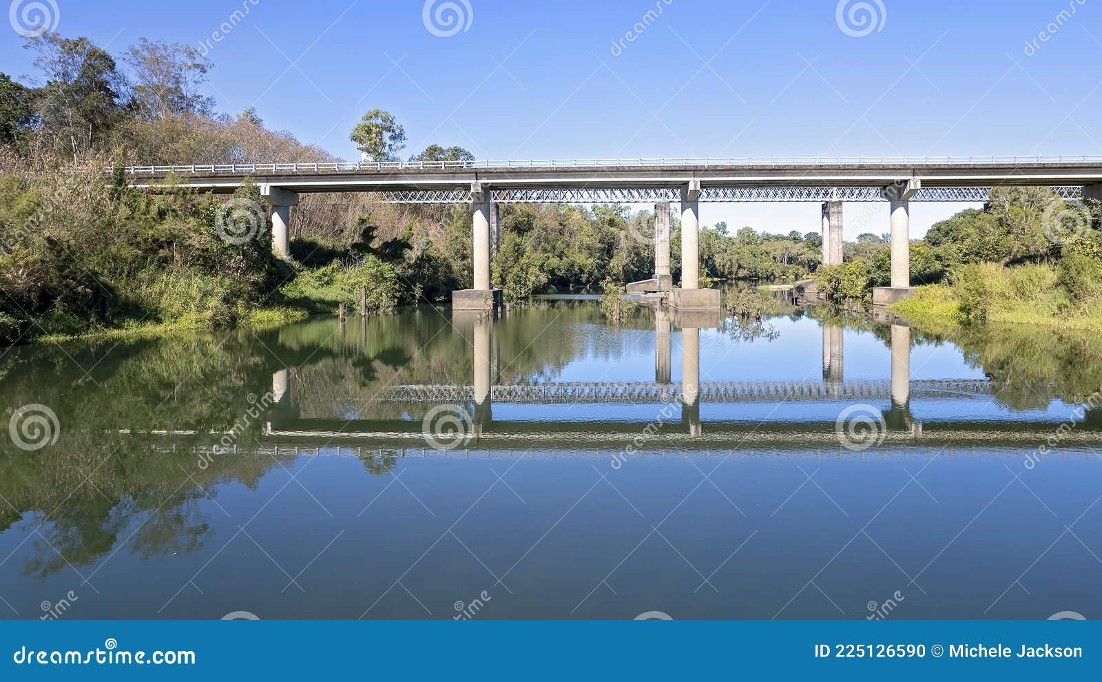 Two Bridges Across a Creek stock photo. Image of bridging - 225126590