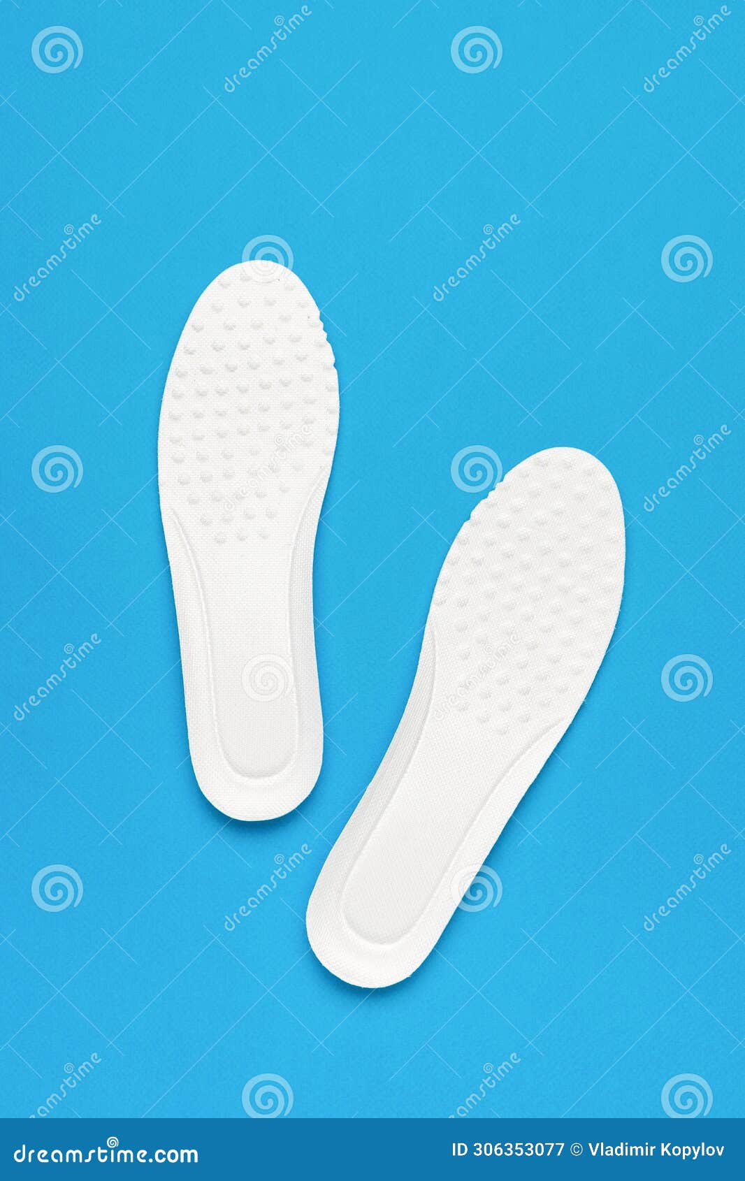 Two Bright White Insoles on a Blue Background Stock Image - Image of ...
