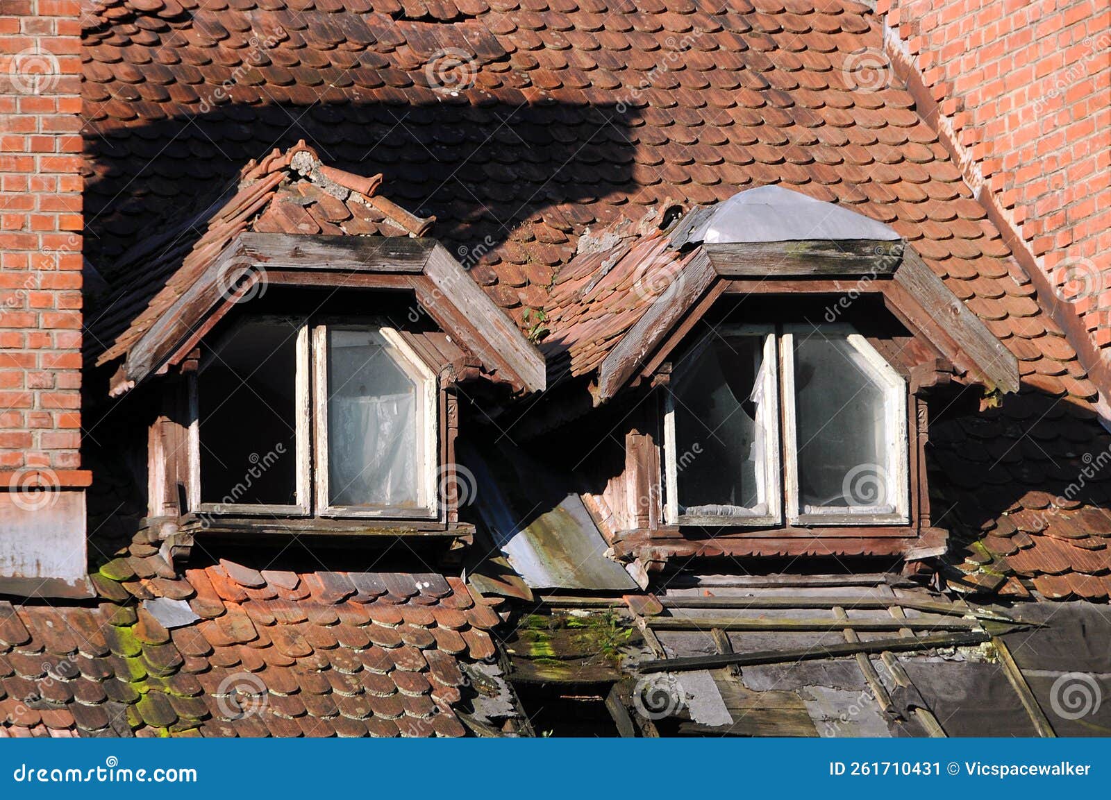 Two broken attic windows stock image. Image of city - 261710431