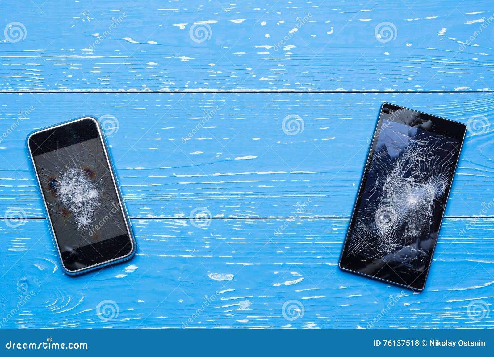 Two Broken Mobile Phones on Vintage Painted Table Stock Photo - Image ...