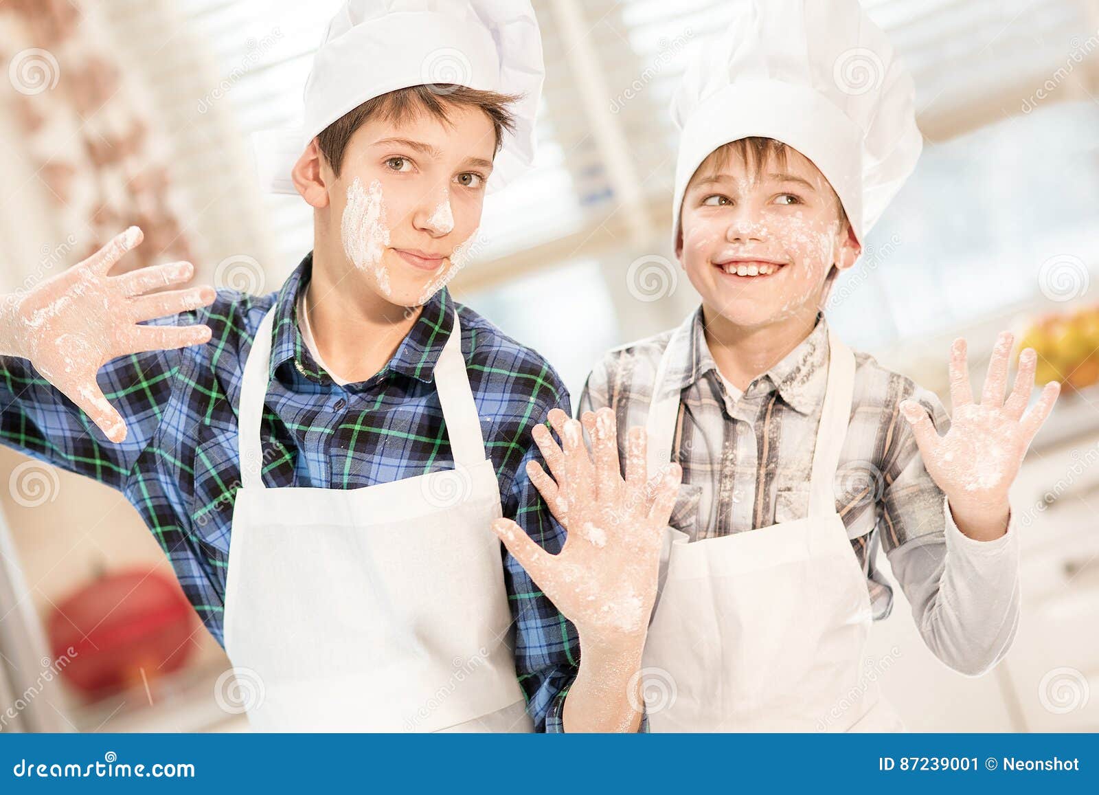 Two brothers in cook hats. stock image. Image of home - 87239001