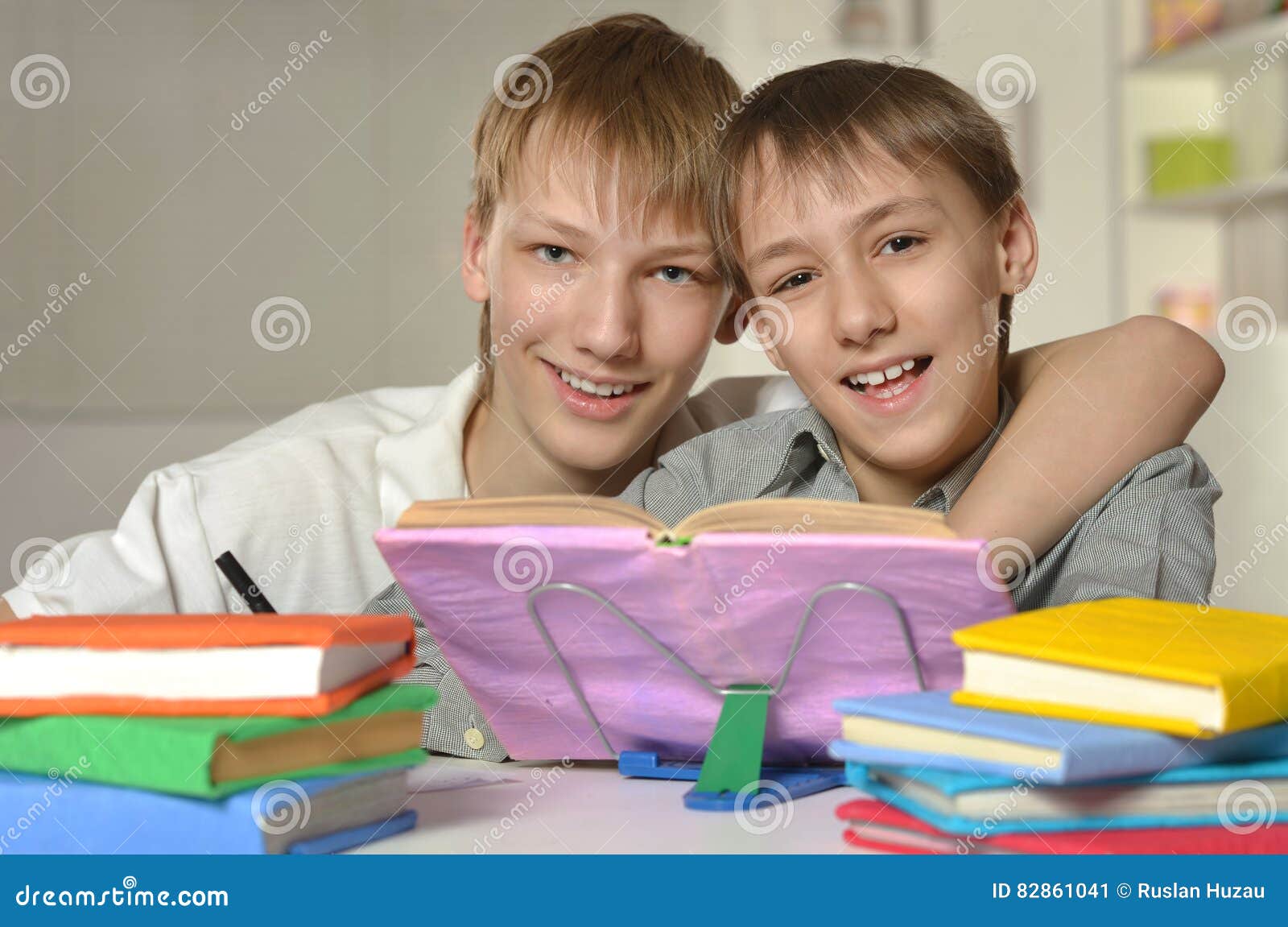 Brothers In The Process Of Distance Learning. The Younger Brother Sits ...