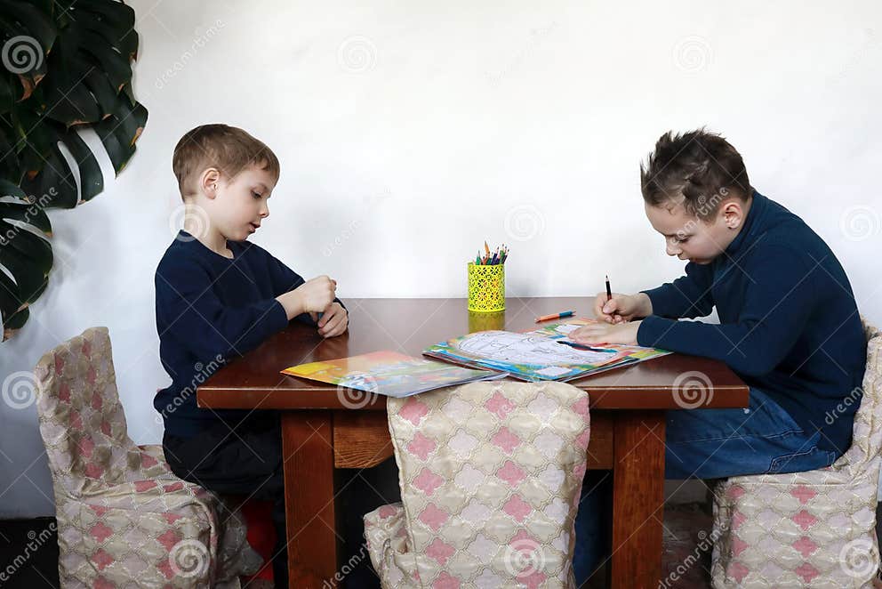 Two Brothers Draw with Pencils Stock Photo - Image of friends, paper ...