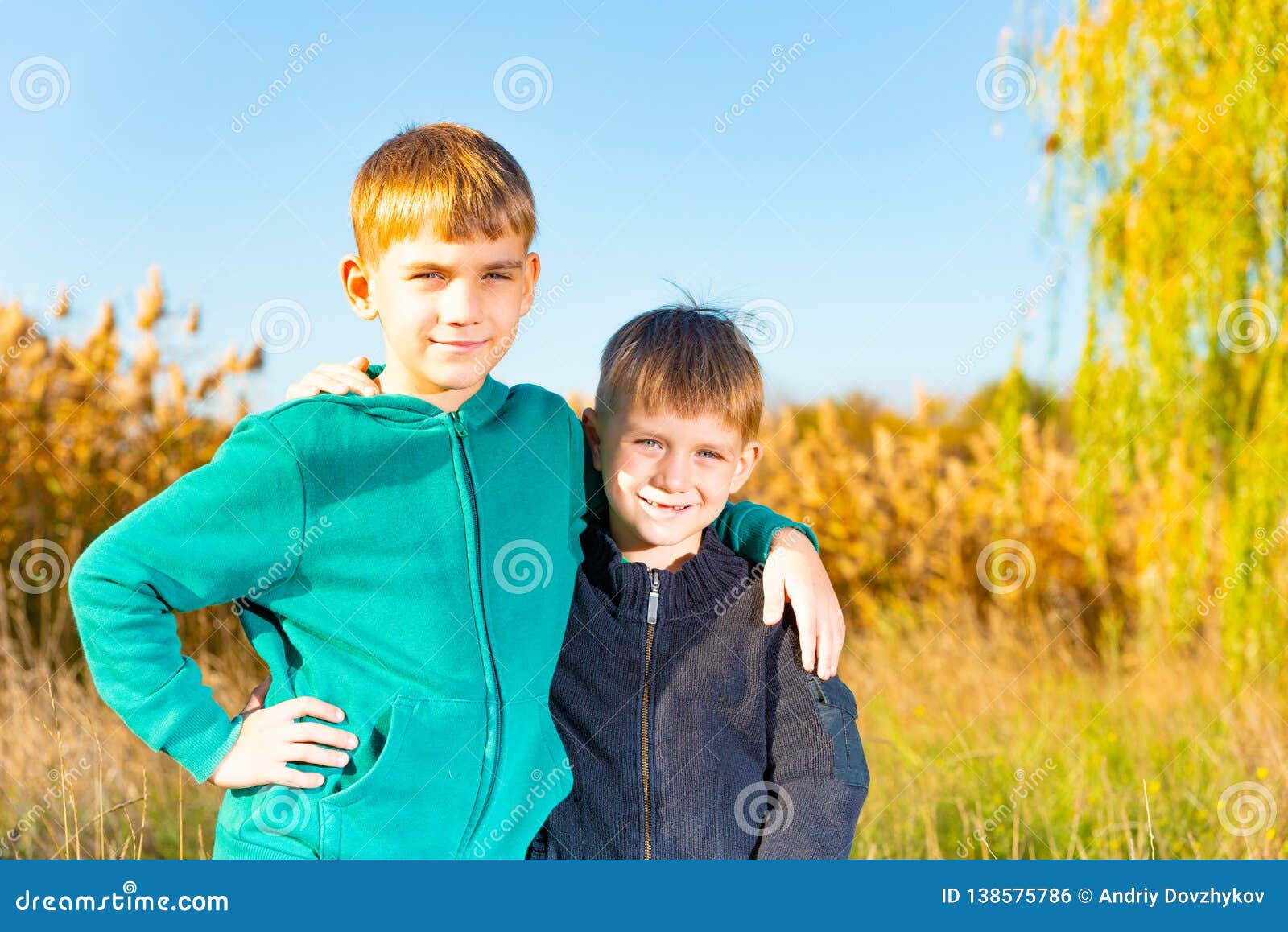 Two Brothers are Embracing in Nature in the Park Stock Photo - Image of ...