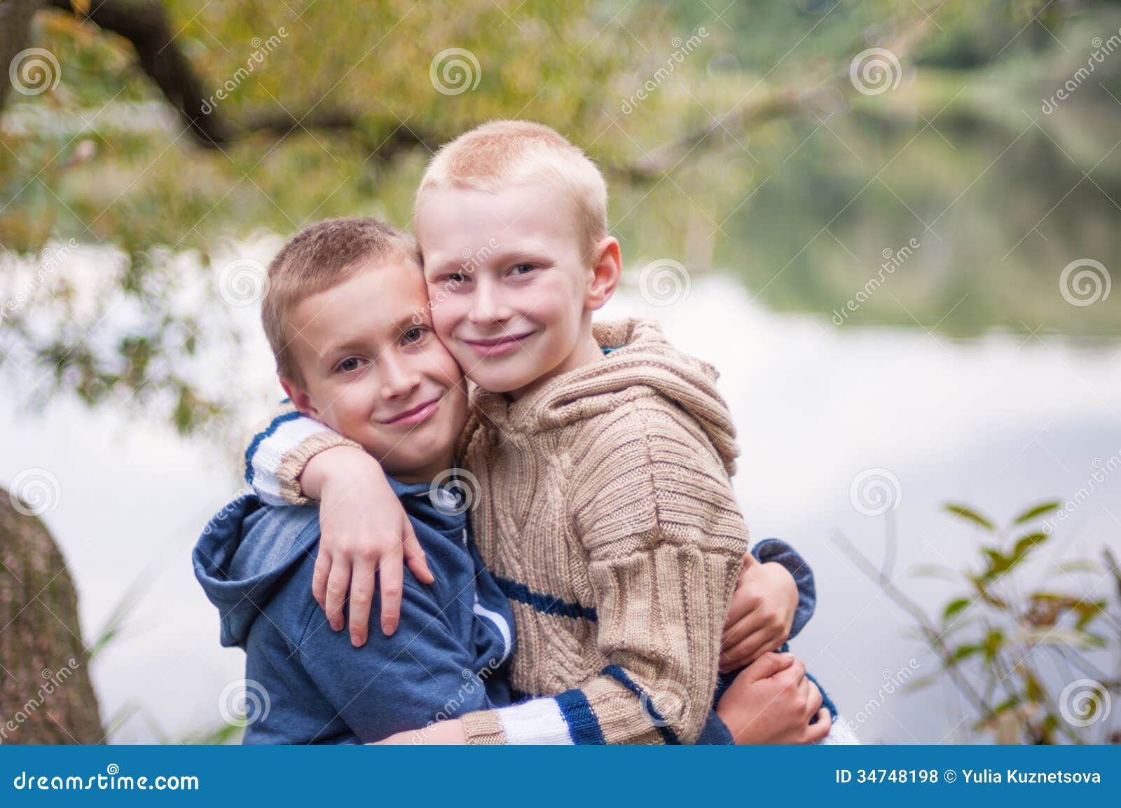 Two brothers embracing stock photo. Image of nature, forest - 34748198