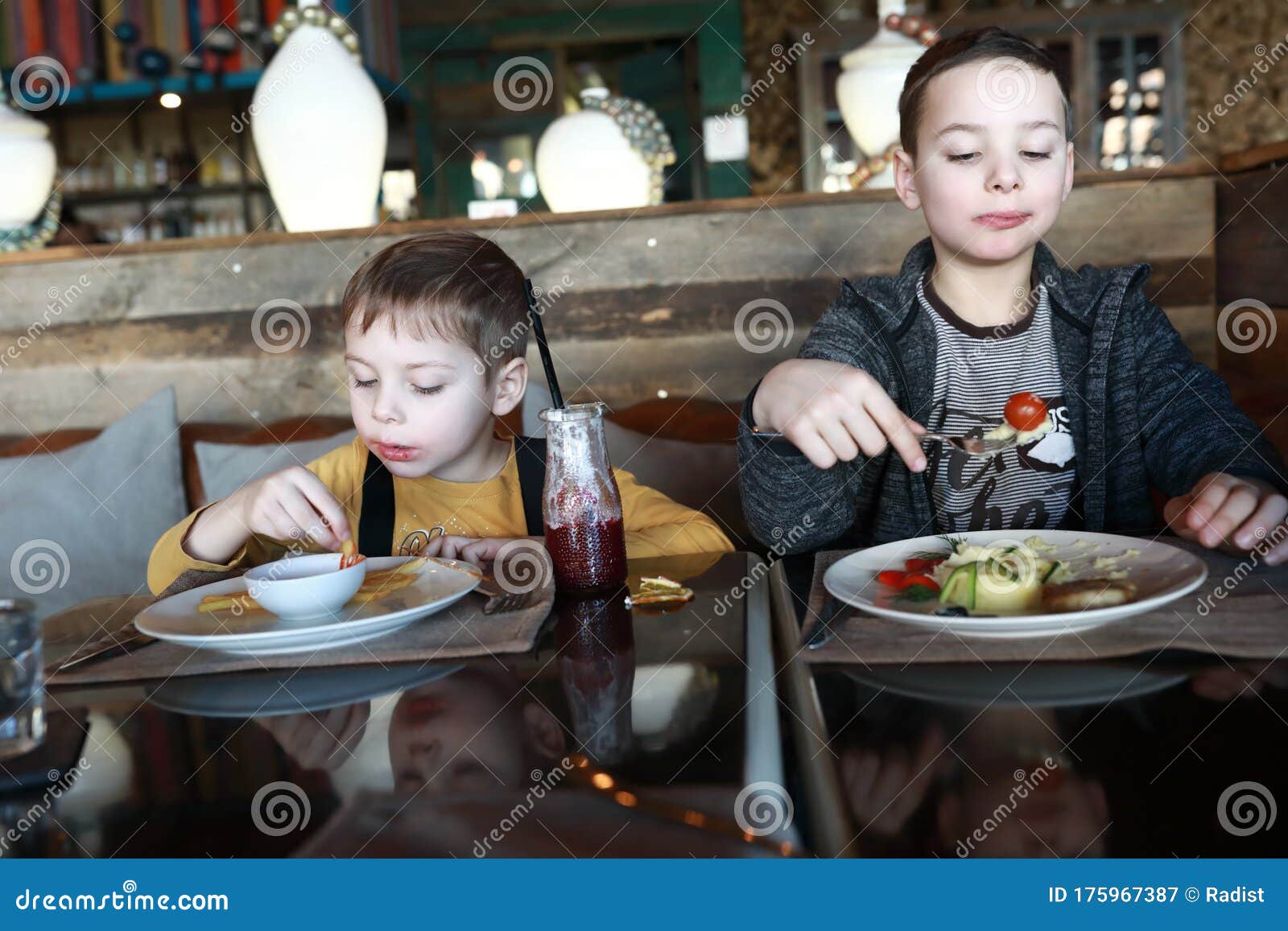 Two brothers have lunch stock image. Image of organic - 175967387