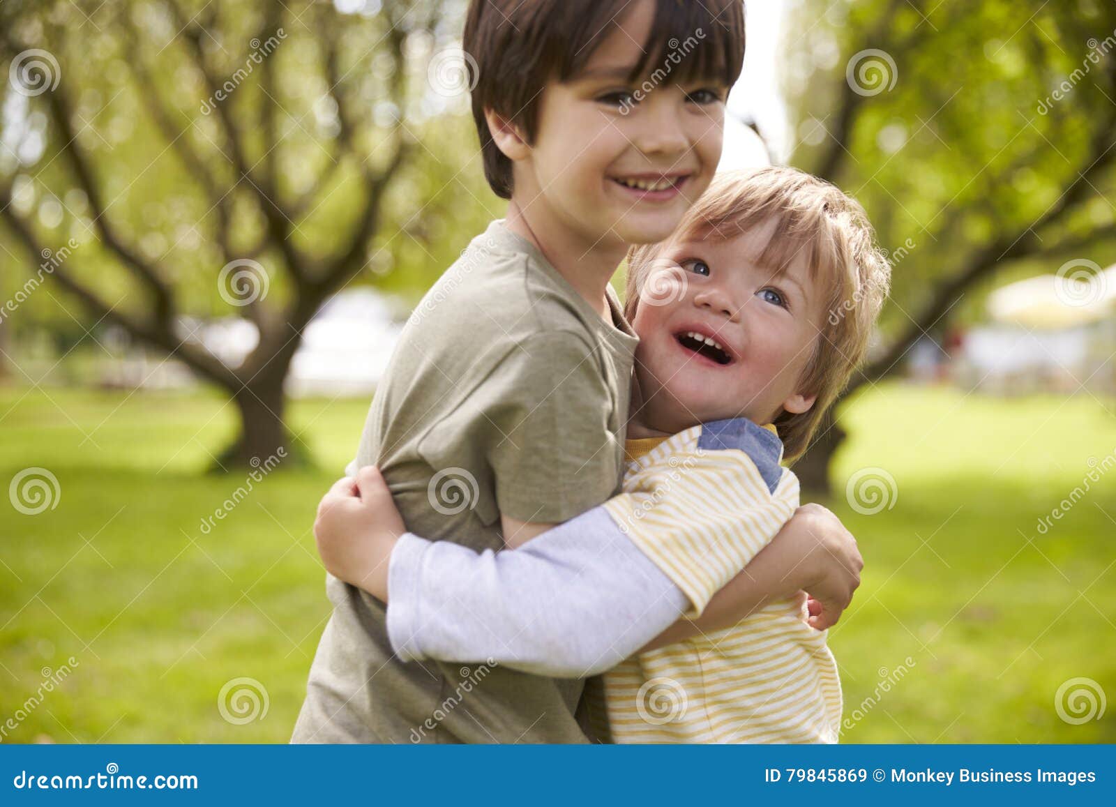 Two Brothers Hugging in Park Together Stock Image - Image of brother ...