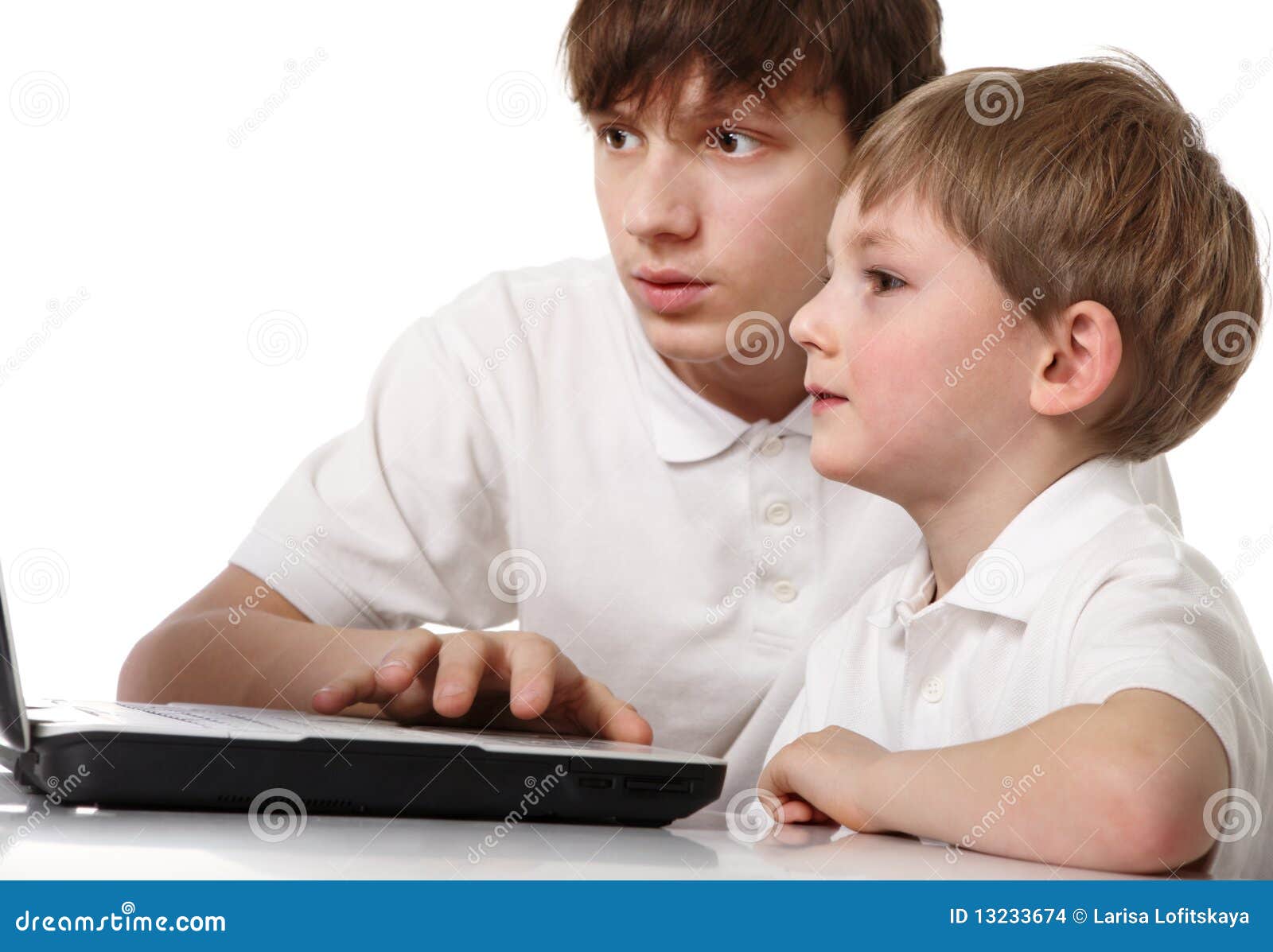 Two brothers with laptop stock photo. Image of sitting - 13233674