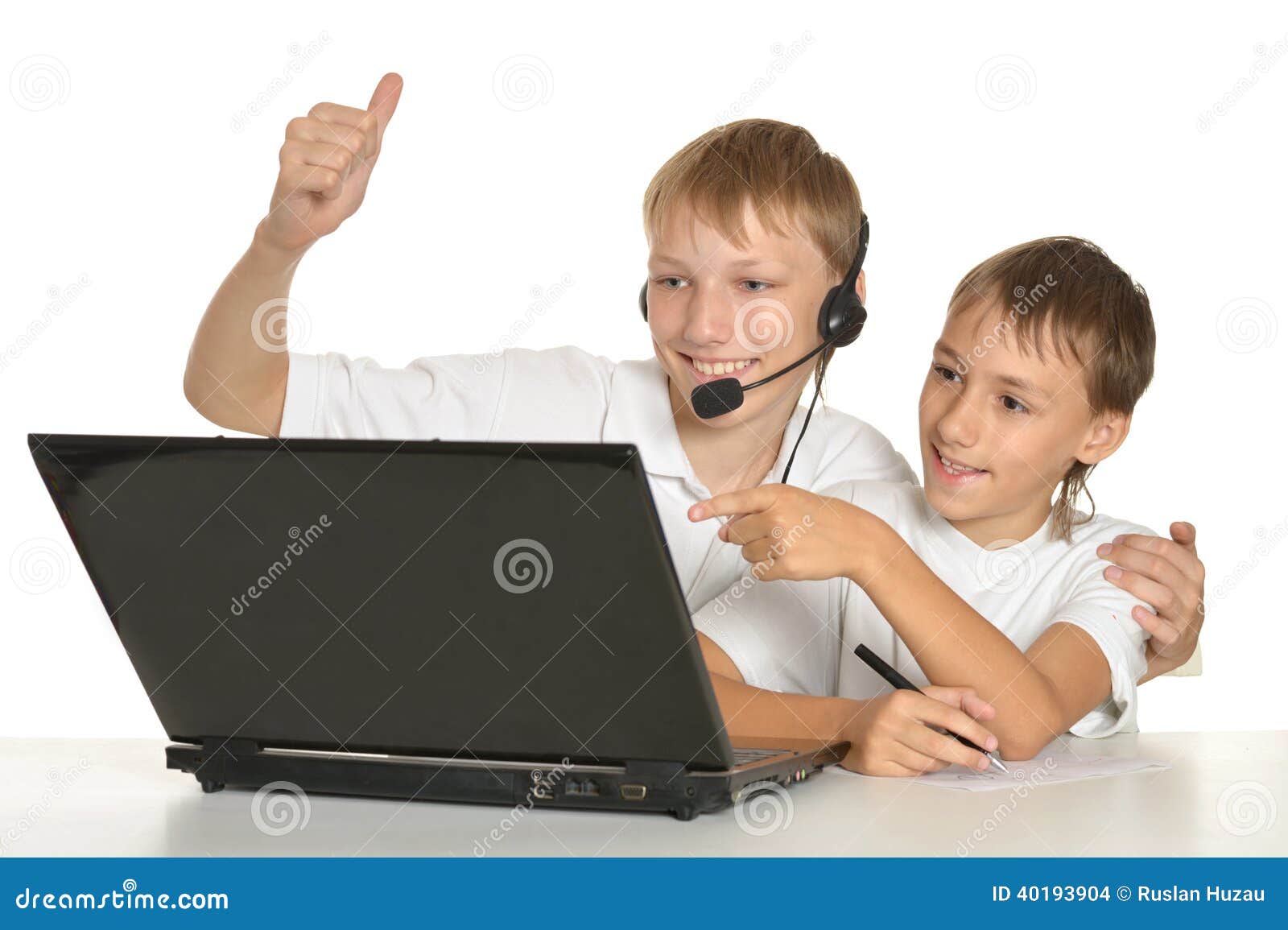 Two brothers with laptop stock photo. Image of isolated - 40193904