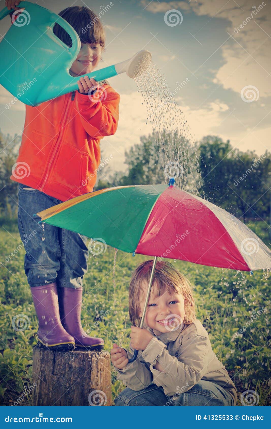 Two brothers play in rain stock image. Image of outdoors - 41325533