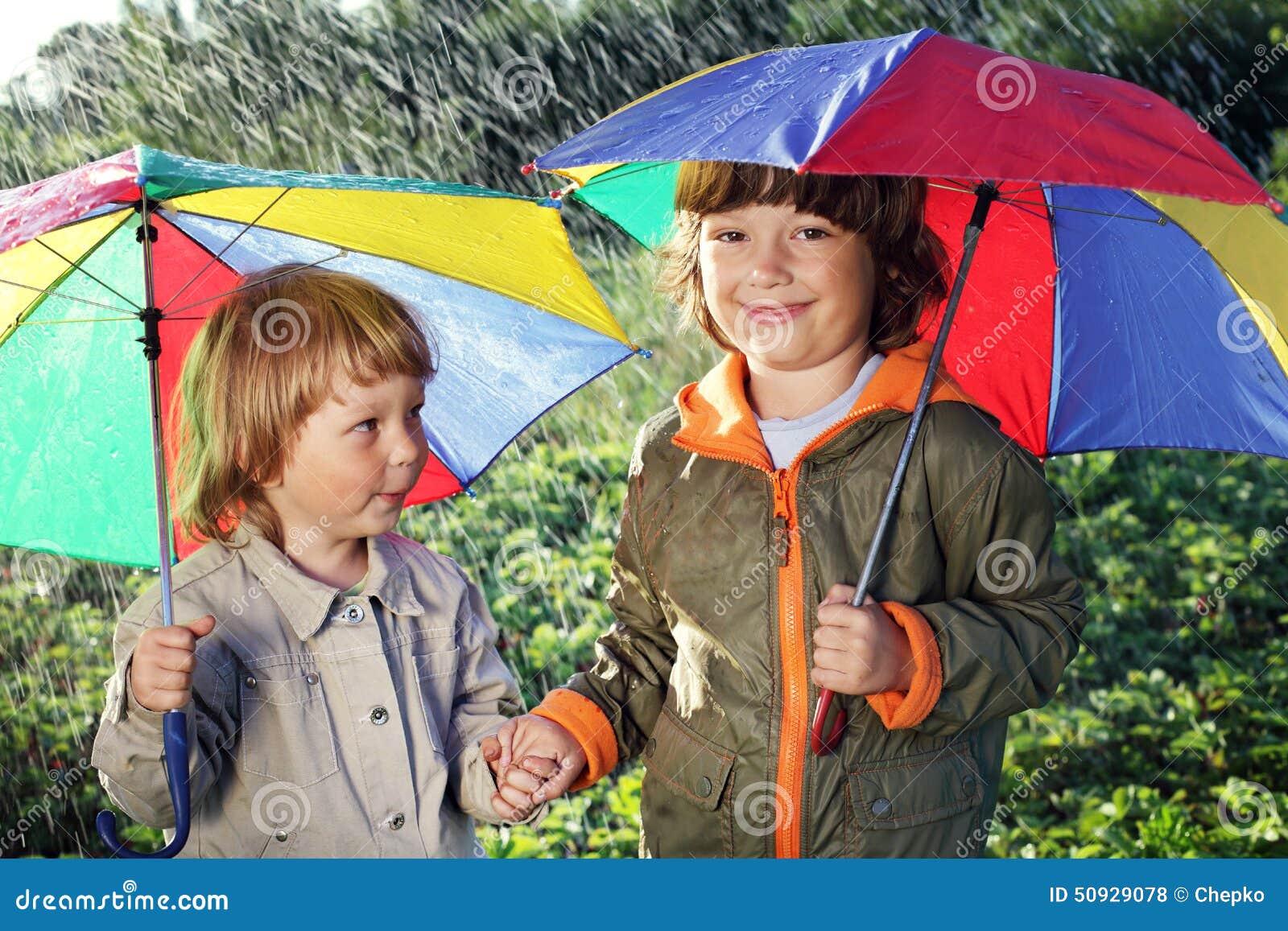 Two brothers play in rain stock photo. Image of cheerful - 50929078