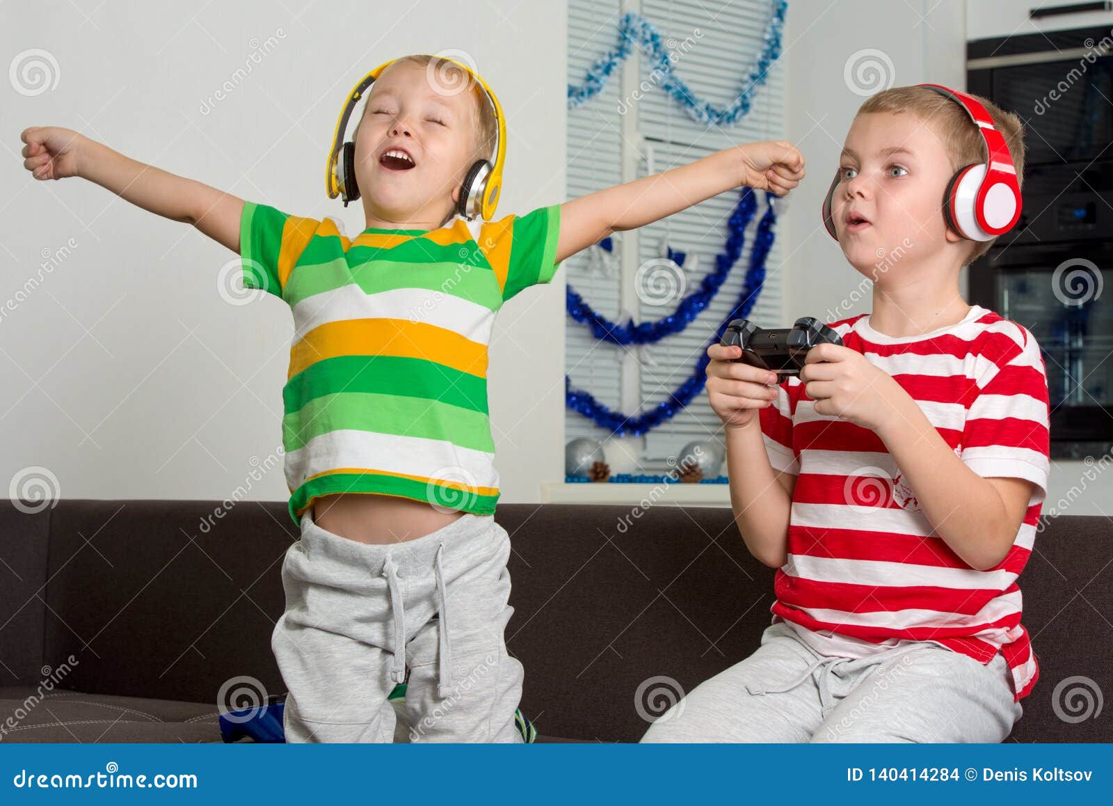Two Brothers Playing in the Headphones Joysticks in Video Games. Stock ... Two Brothers Playing in the Headphones Joysticks in Video Games. Stock ...