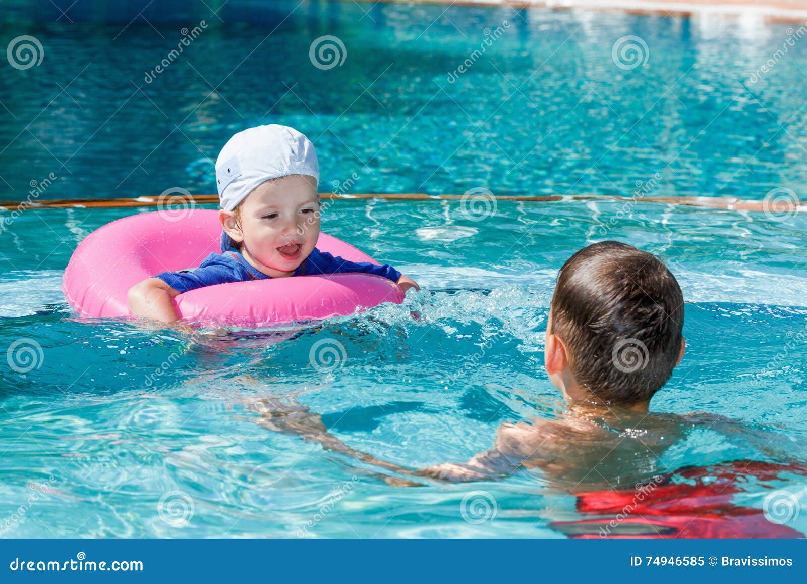 Two Brothers Playing in the Pool Stock Image - Image of preserver ...
