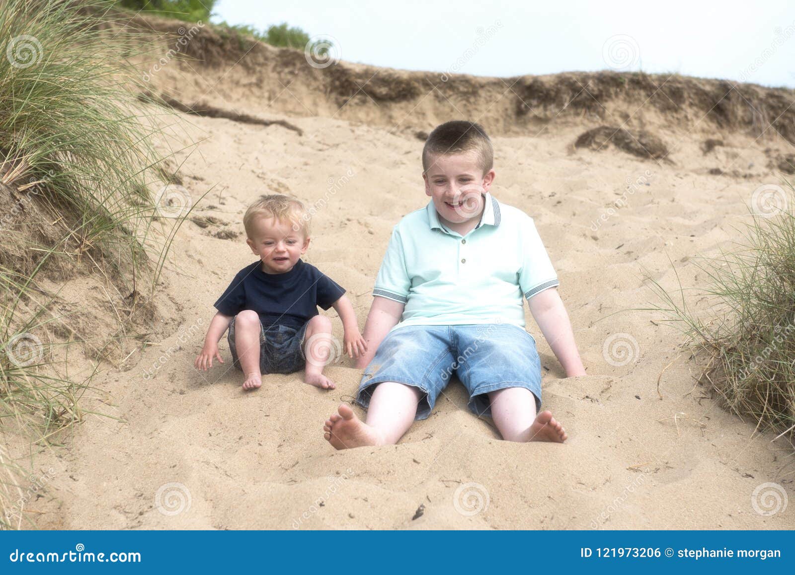 Two Brothers Playing in the Sand Stock Photo - Image of boys, family ...