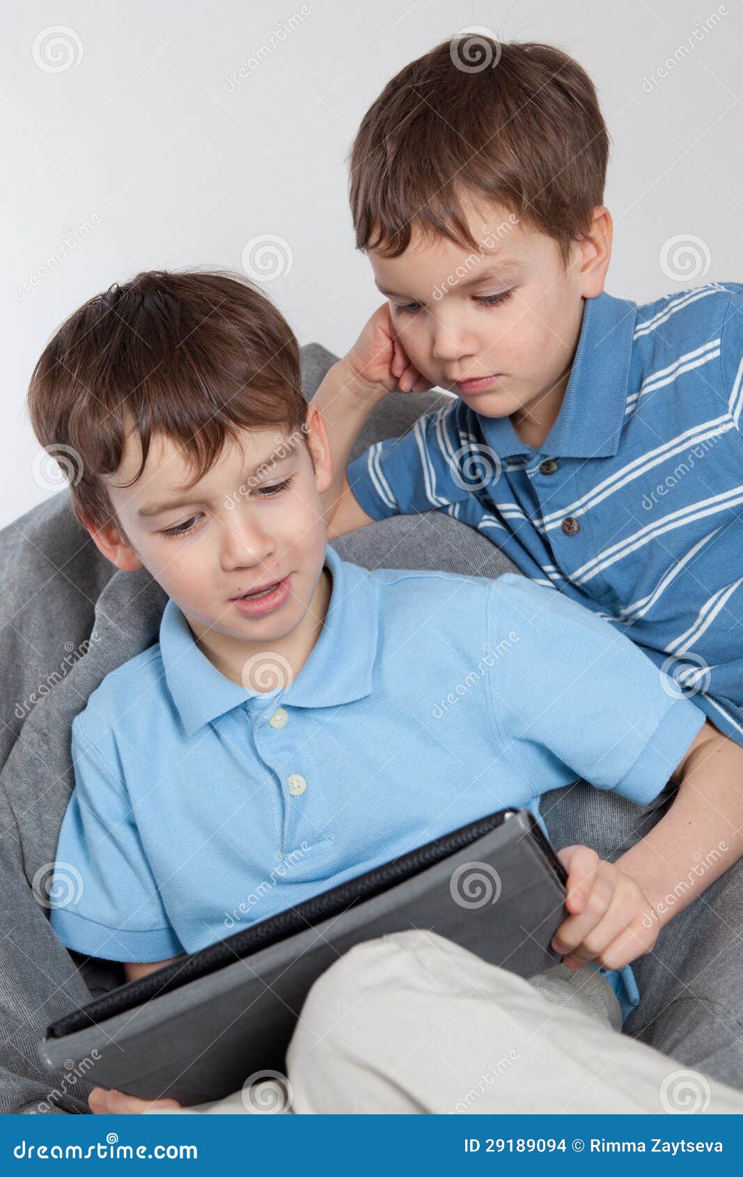 Two Brothers Playing on Tablet Stock Photo - Image of family ...