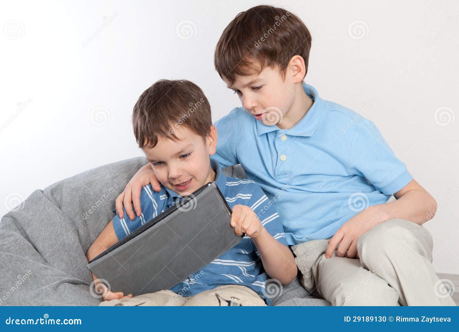 Two Brothers Playing on Tablet Stock Photo - Image of family, notebook ...