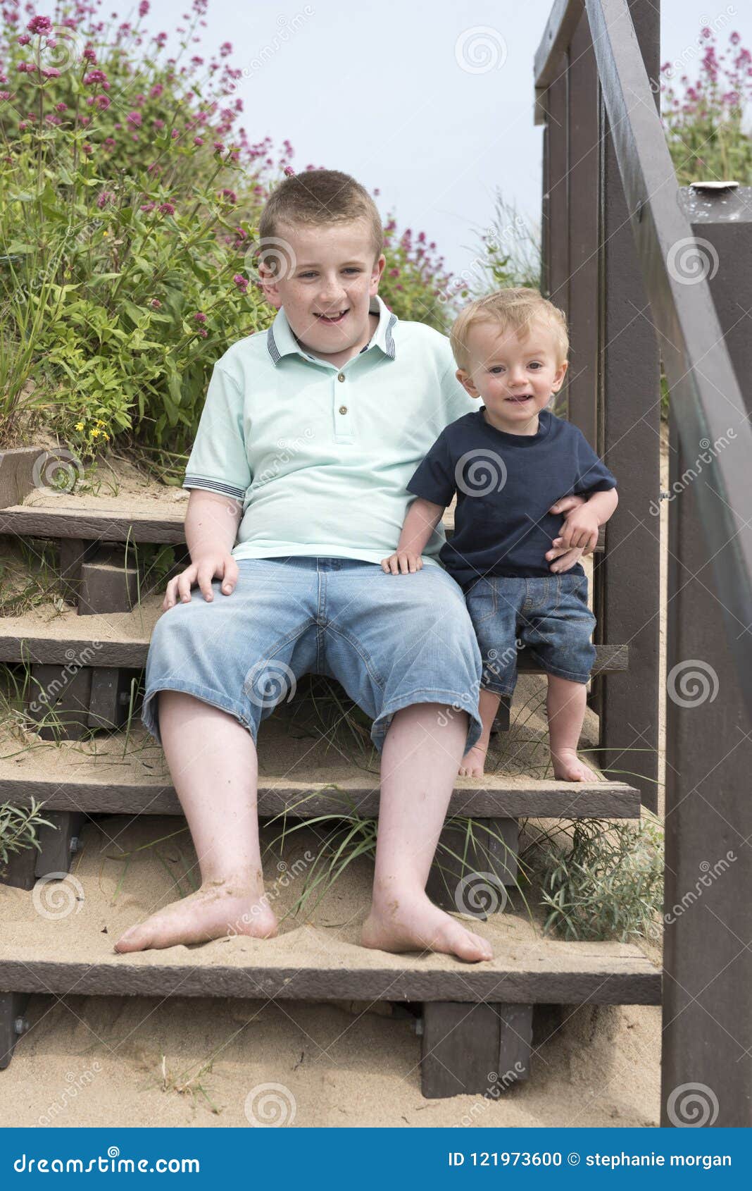 Two Brothers Playing Together on the Beach Stock Photo - Image of ...