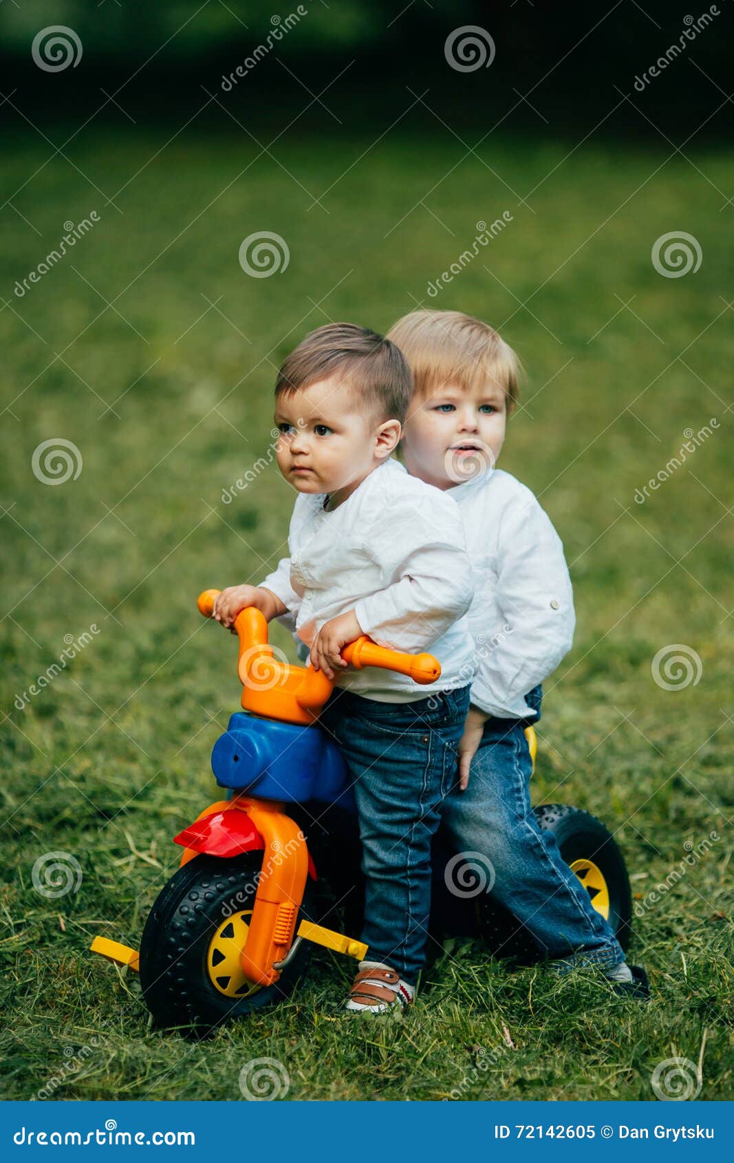 Two Brothers Ride a Bicycle Stock Image - Image of park, exercise: 72142605
