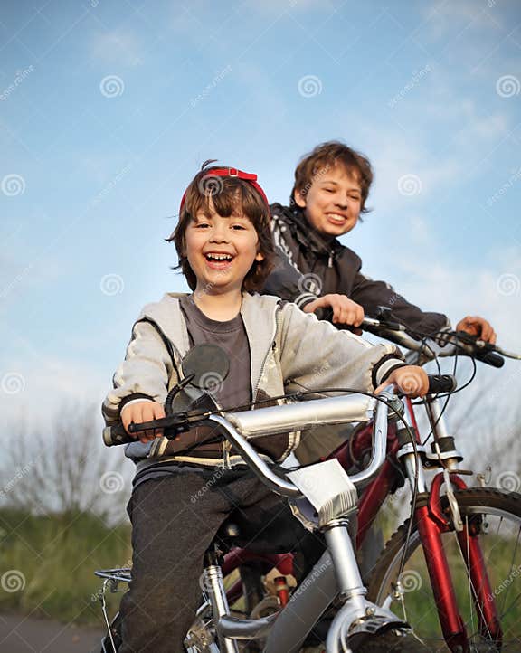 Two brothers ride bikes stock image. Image of american - 40255455