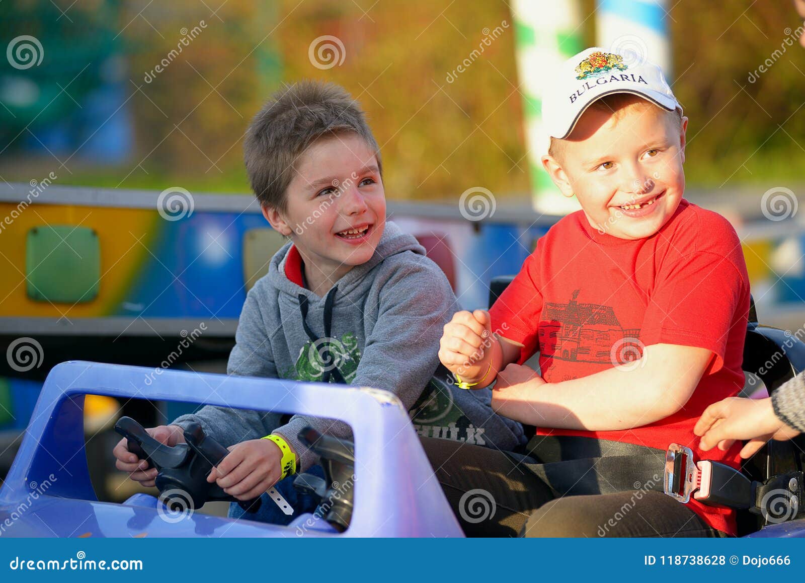 Two Brothers Ride on the Carousel Stock Photo - Image of ride, friends ...