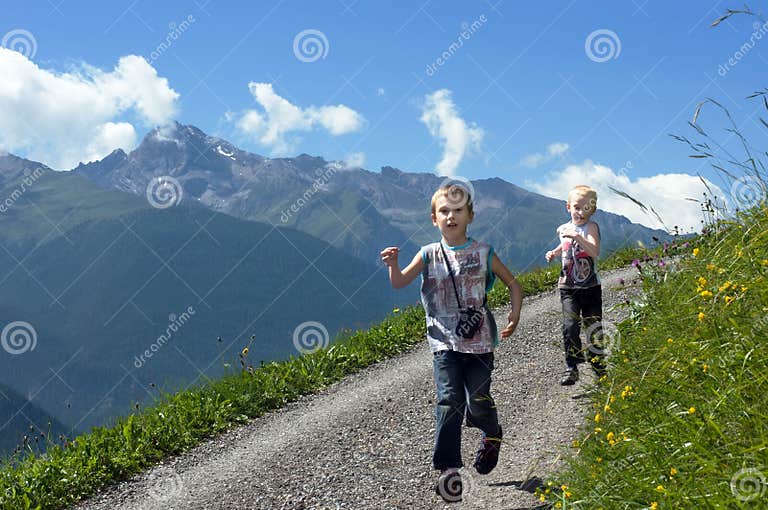 Two Brothers Running on Mountain Path Stock Photo - Image of climbing ...