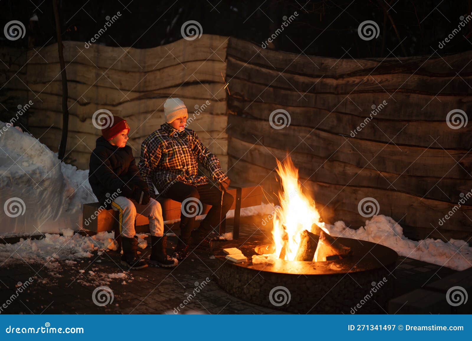 Two Brothers Sit by the Fire Pit in Winter Night Stock Image - Image of ...