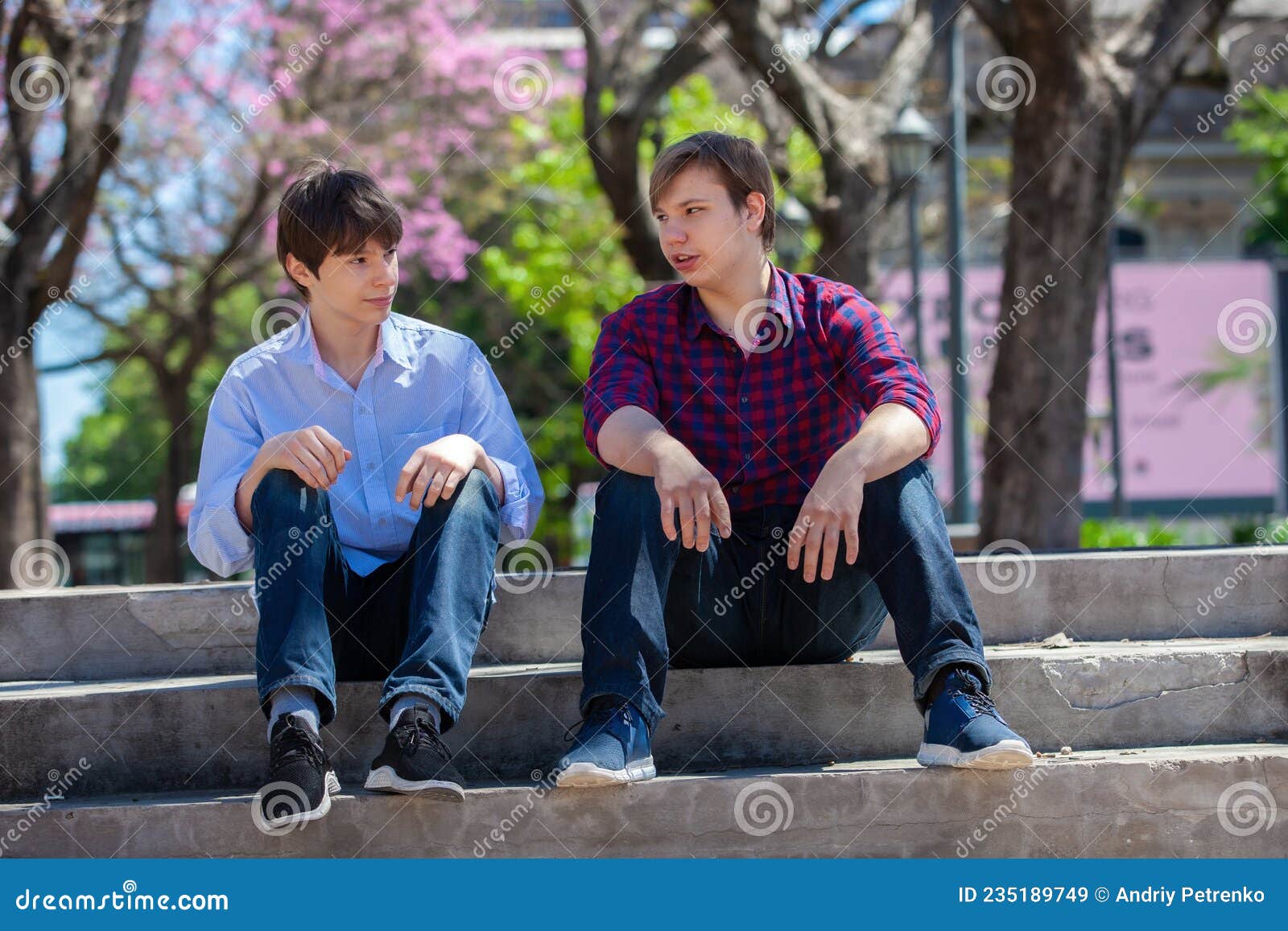 Two Brothers Sit on the Steps in the Park Stock Image - Image of ...